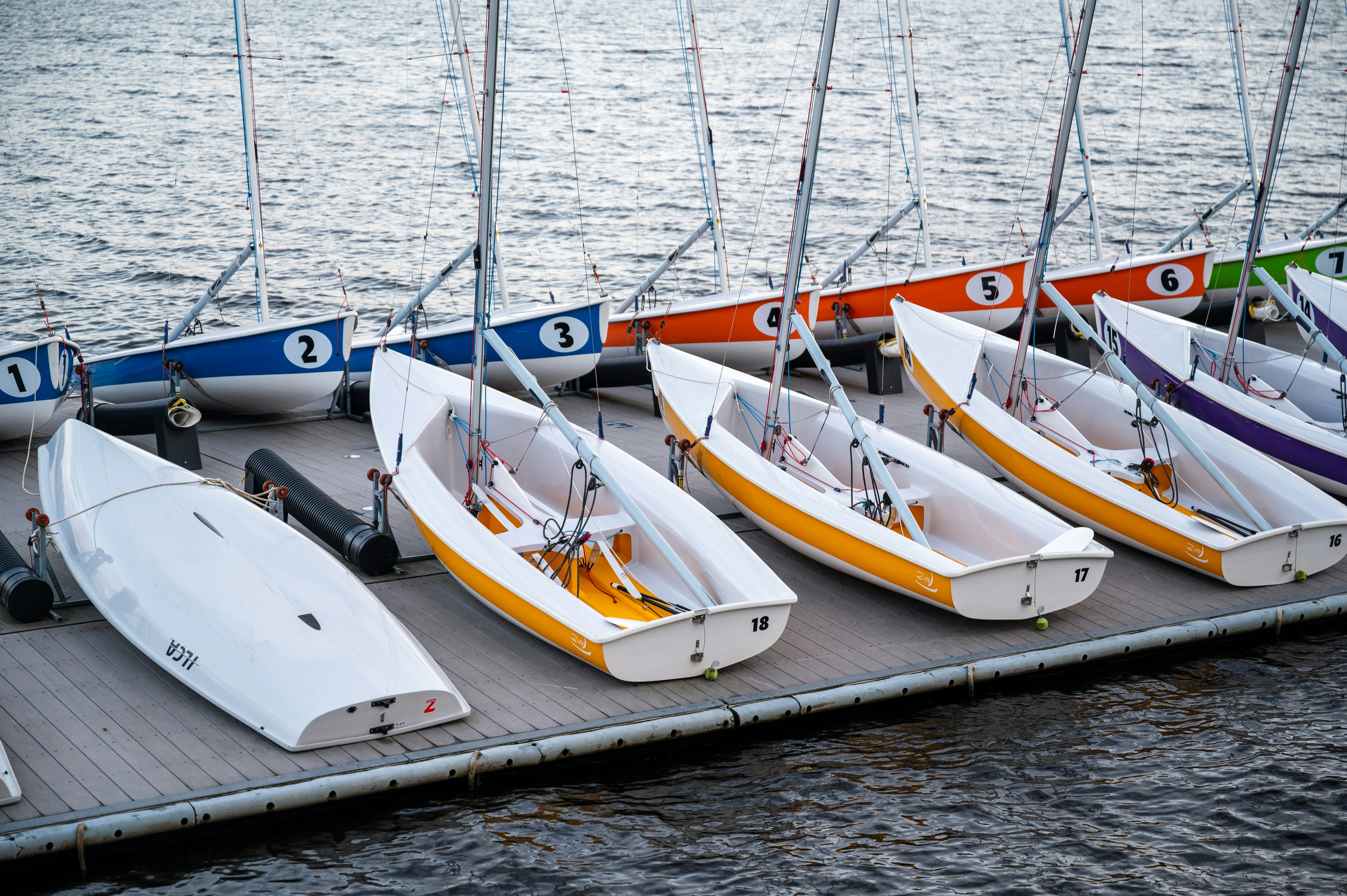 A group of boats sit on the water photo – Free Vessel Image on Unsplash