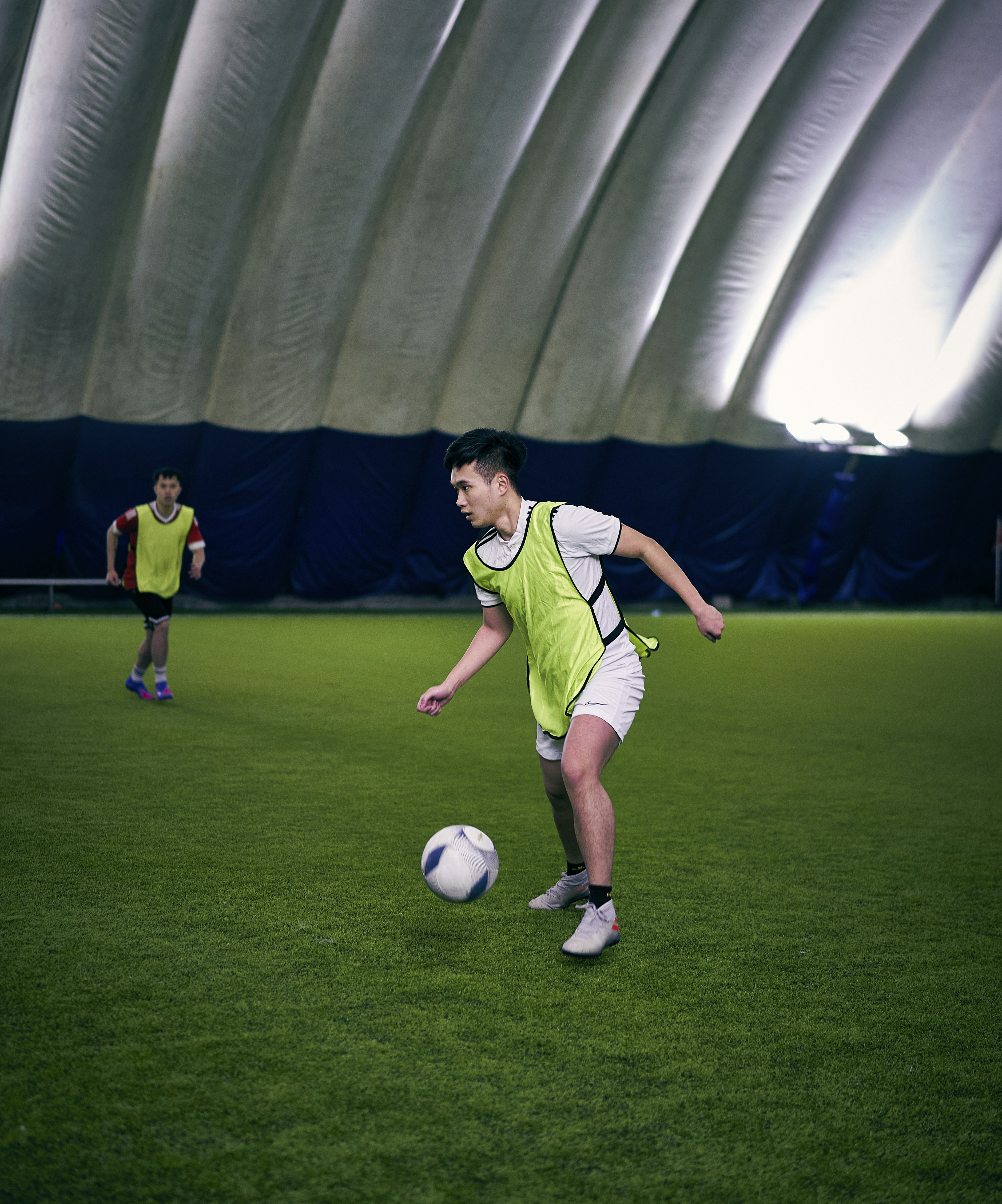 Neon Bib Dribbler Under the Indoor Dome