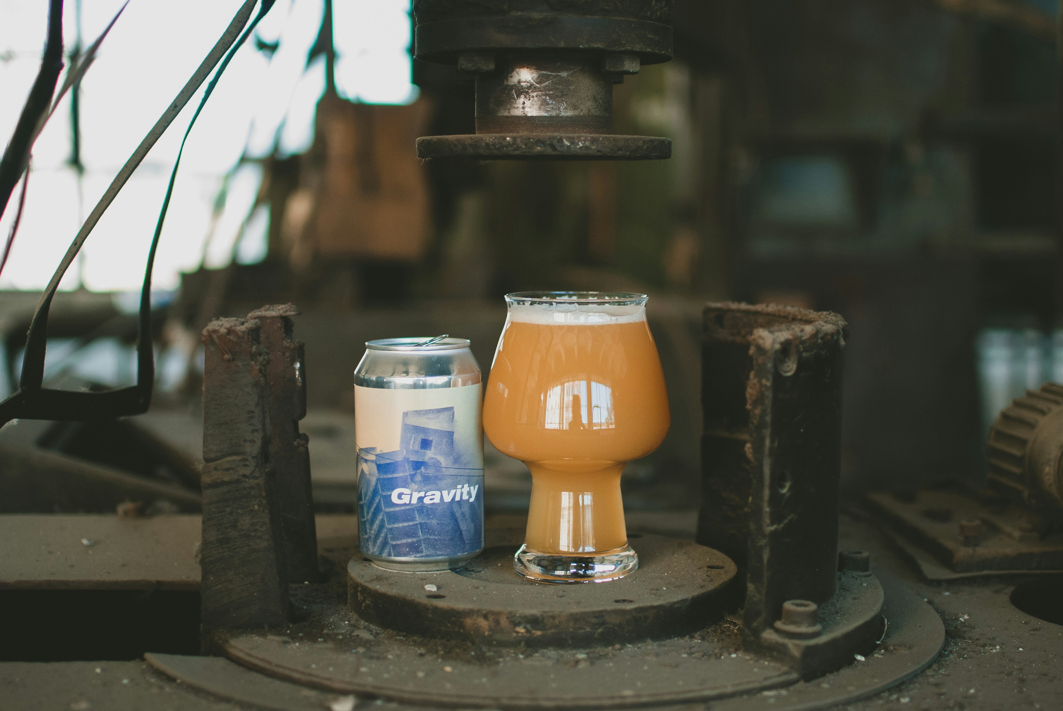 Gravity Among Gears: A Glass of Amber in a Rusted Workshop