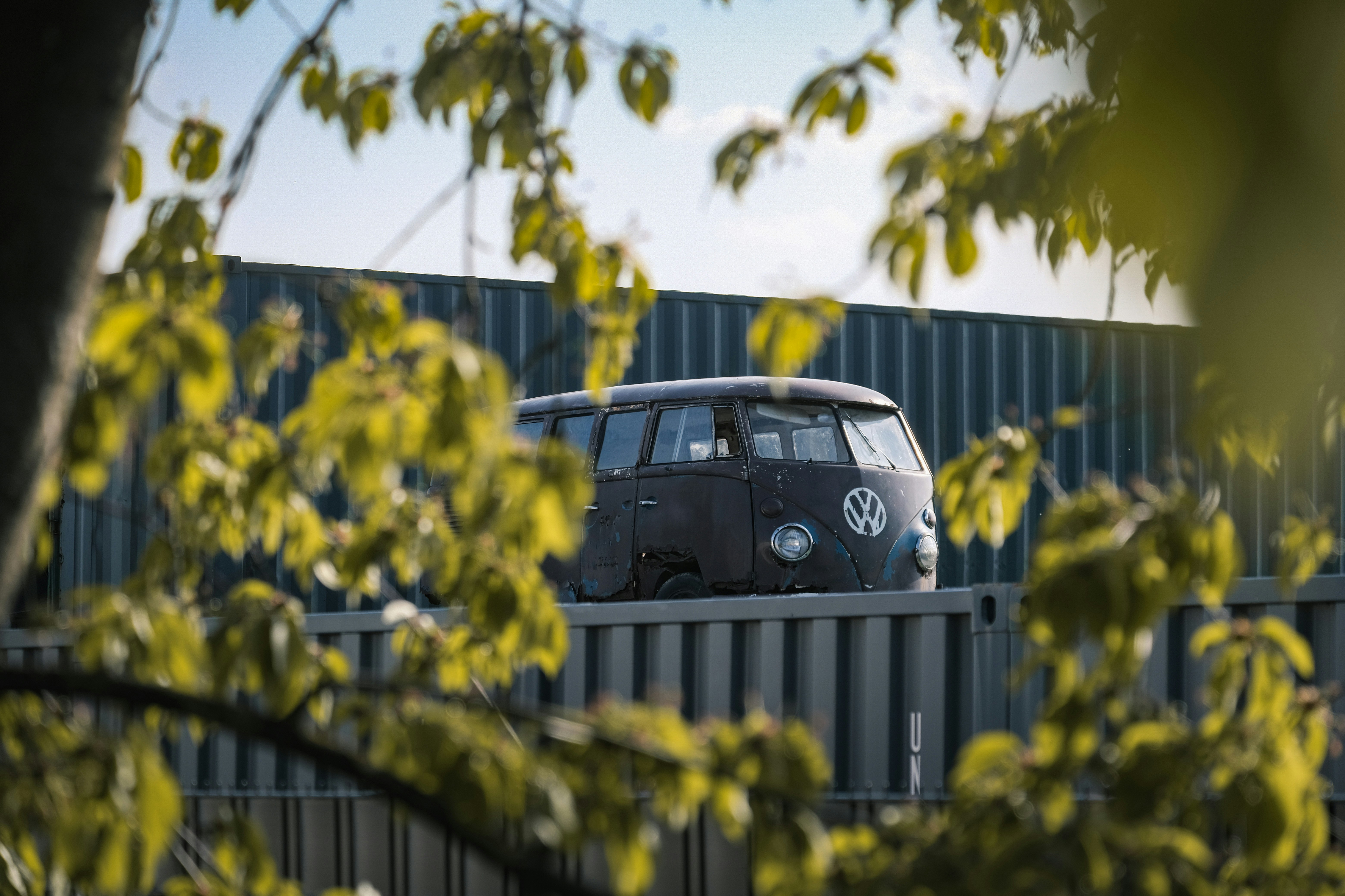 Overpass Reverie: A Vintage VW Camper Framed by Greenery