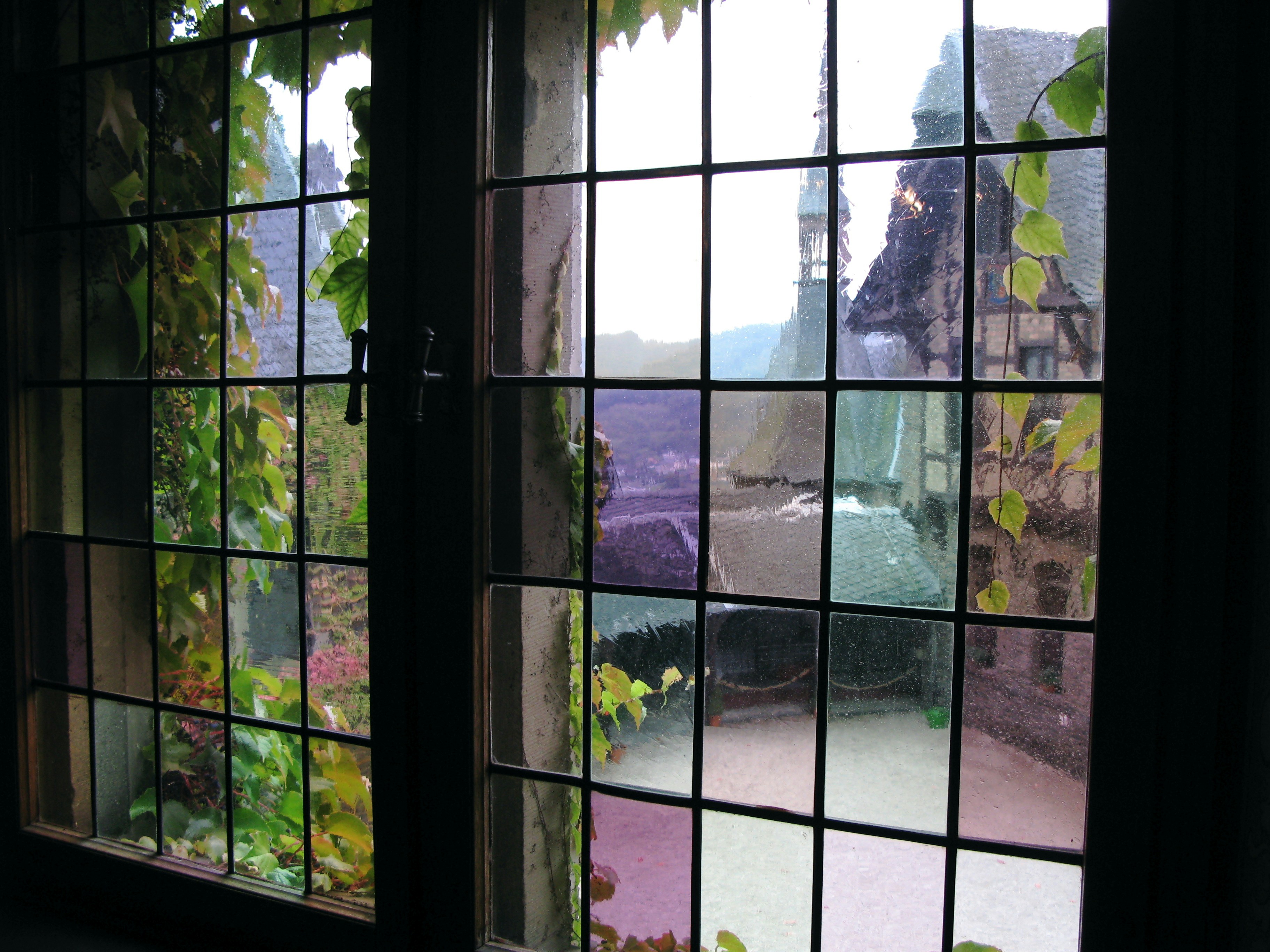 a view of a window with trees outside