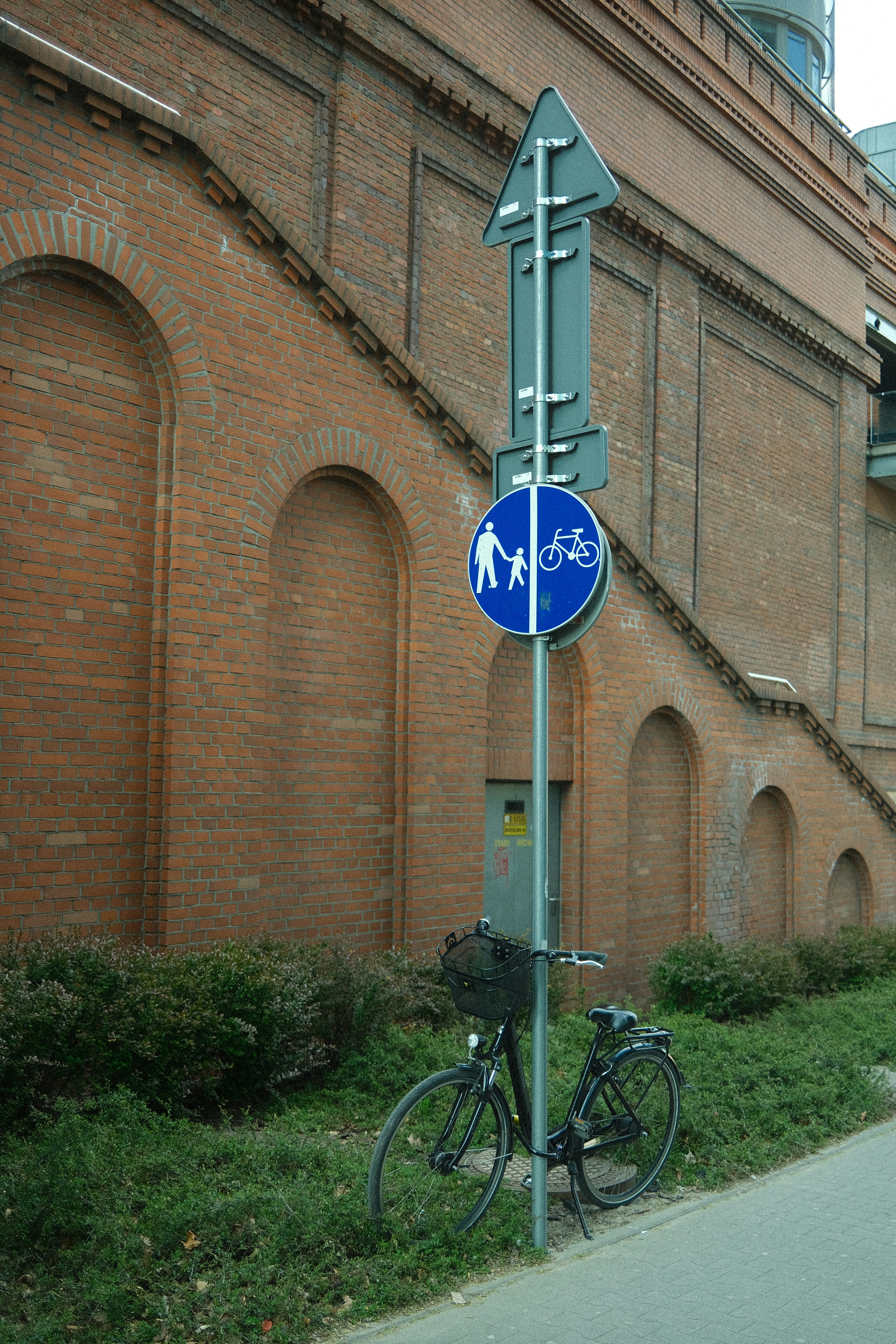 a bicycle is parked on a street sign