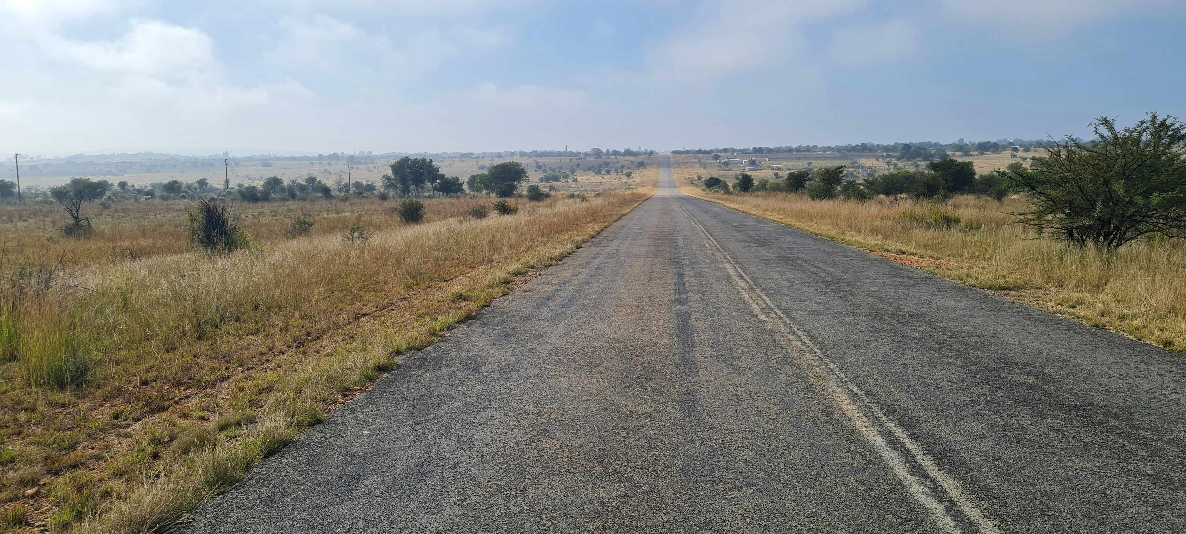A road with grass on the side photo – Free Grey Image on Unsplash