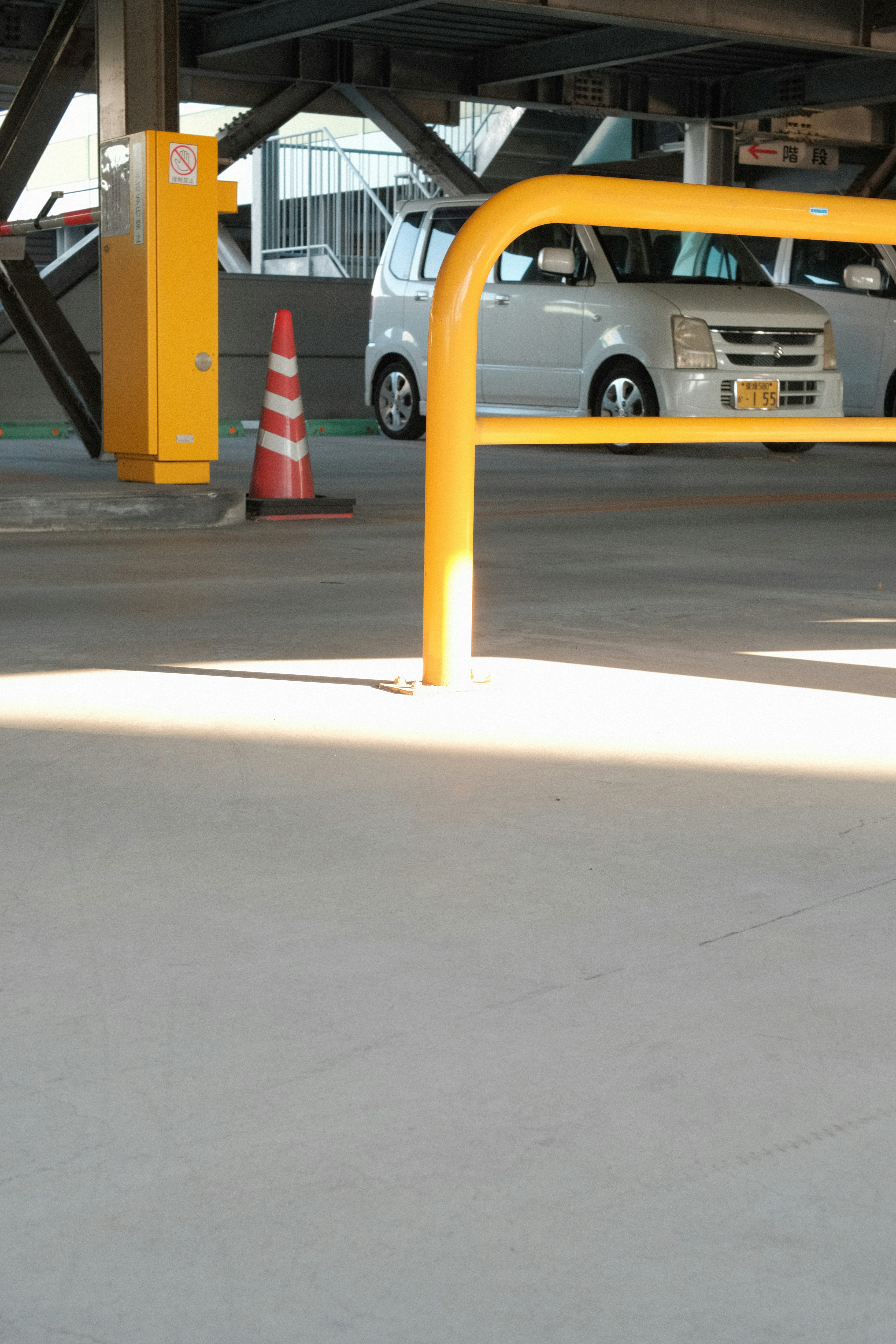 a parking garage with cars parked in it