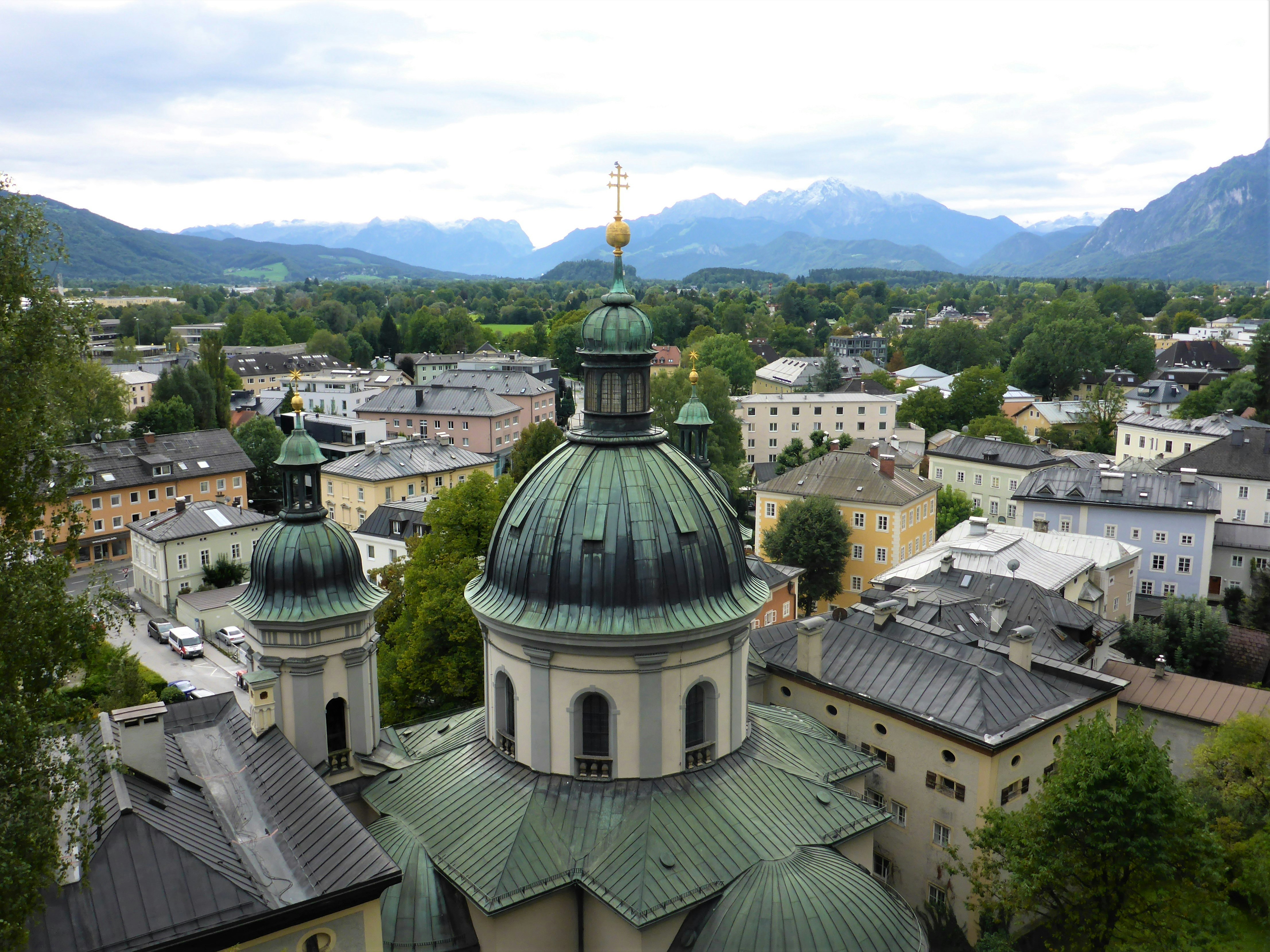 Emerald Dome Over the Alpine Town: An Aerial Portrait of Quiet Rooftops and Peaks