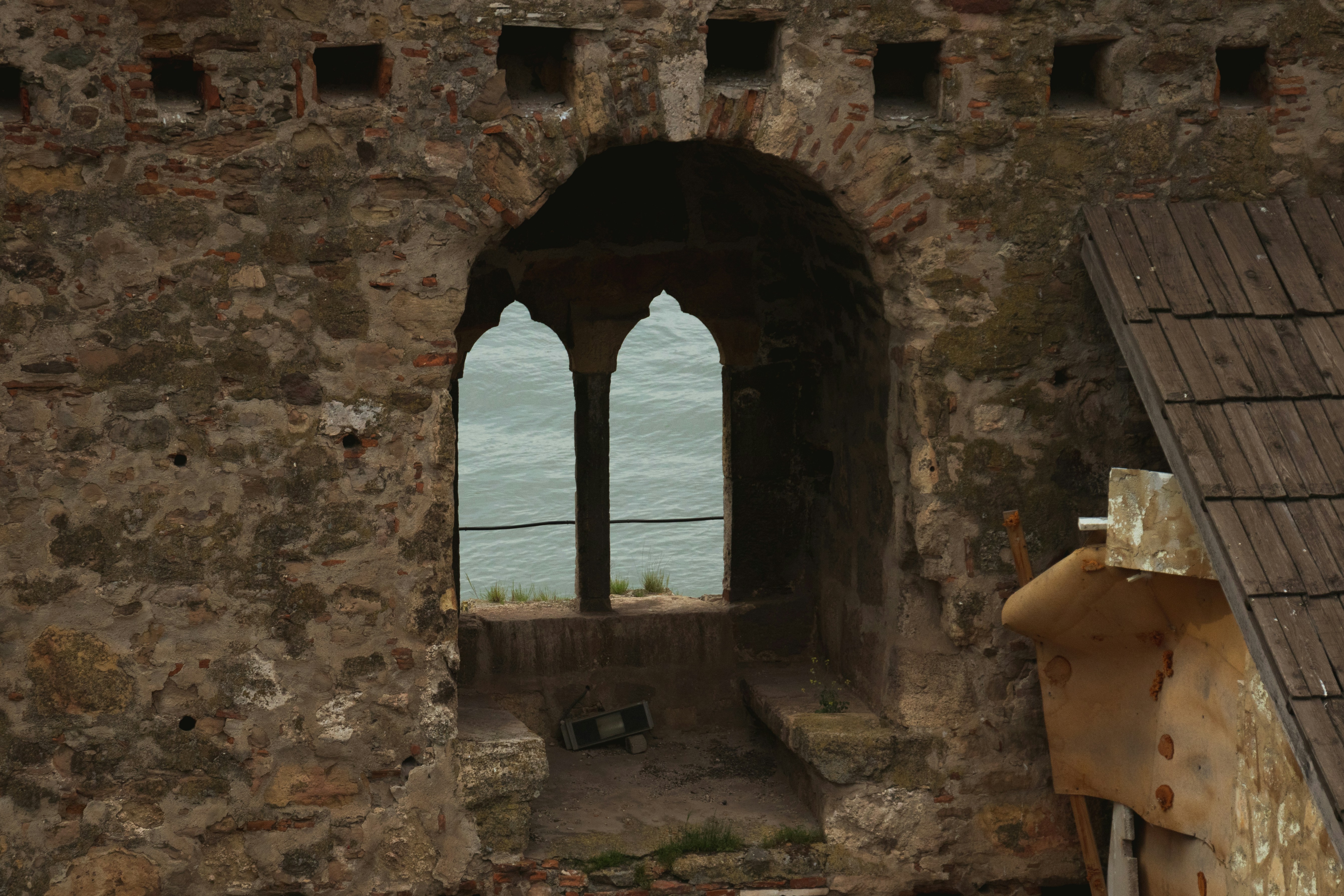 Archway Vista: Framing the Sea Through a Weathered Ruin
