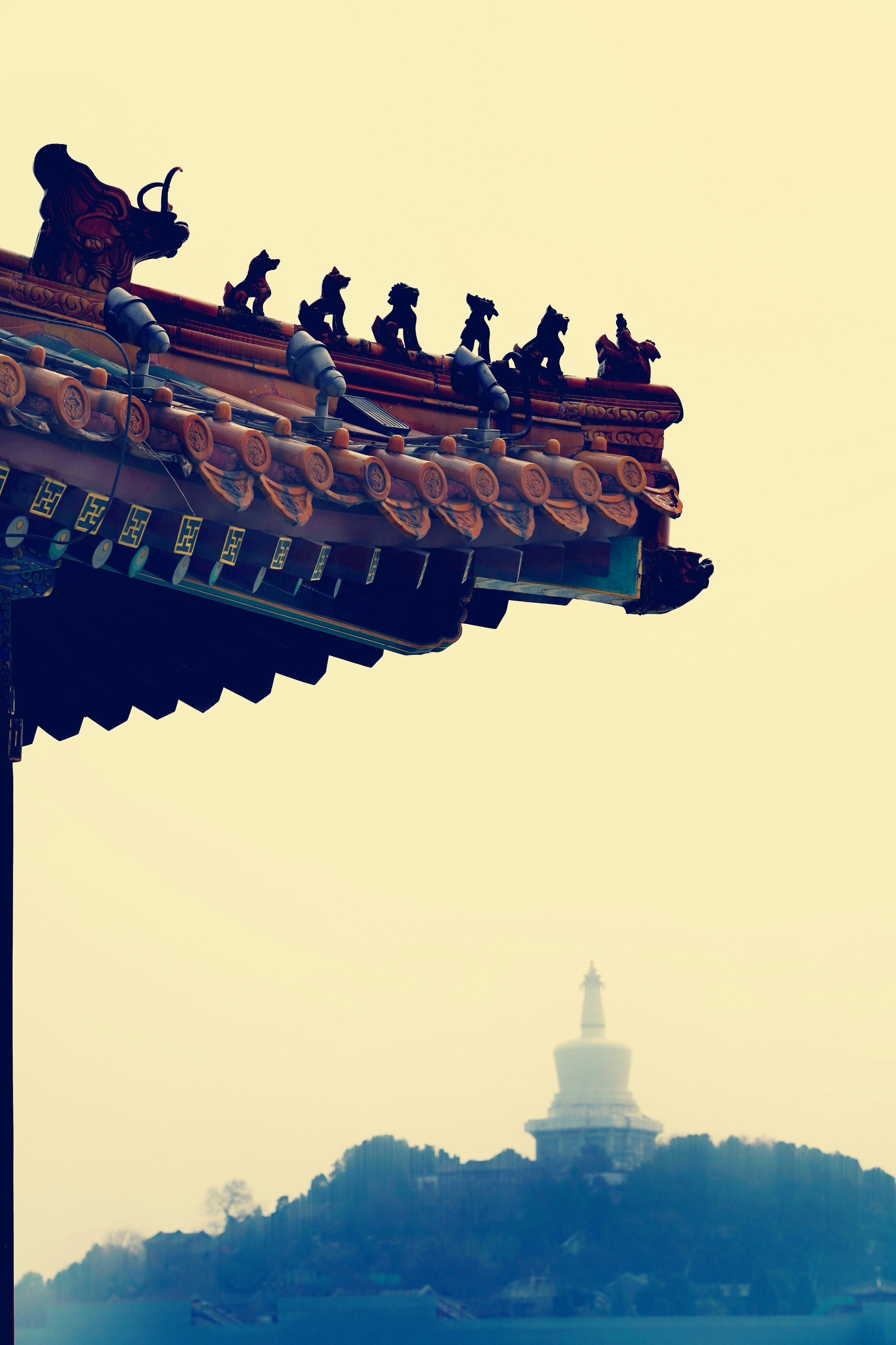Dragoncrest Eaves: Silhouettes on a Corridor Roof with a Distant Pagoda