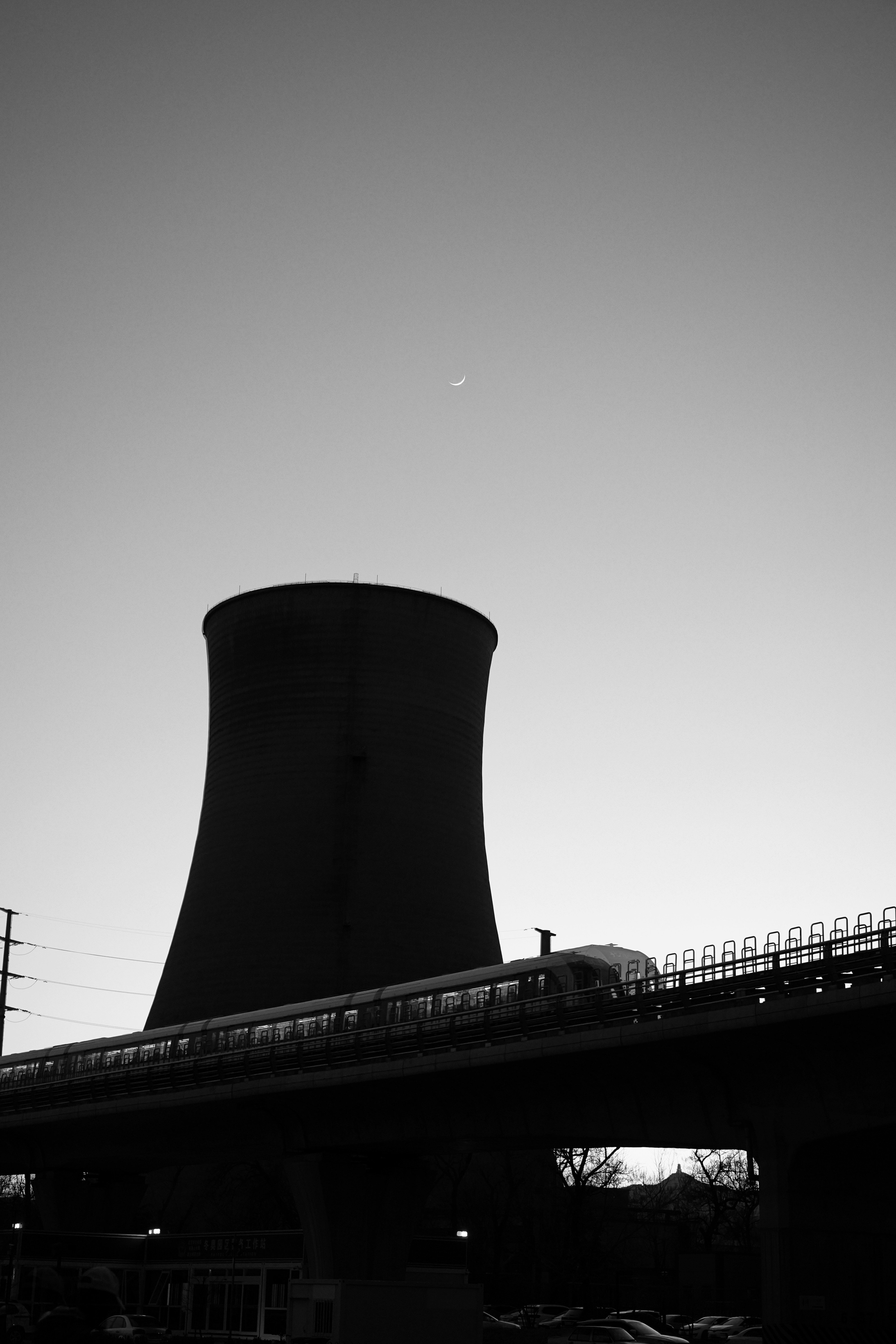 Moon Over the Monolith: A Monochrome Silhouette of Industrial Quiet