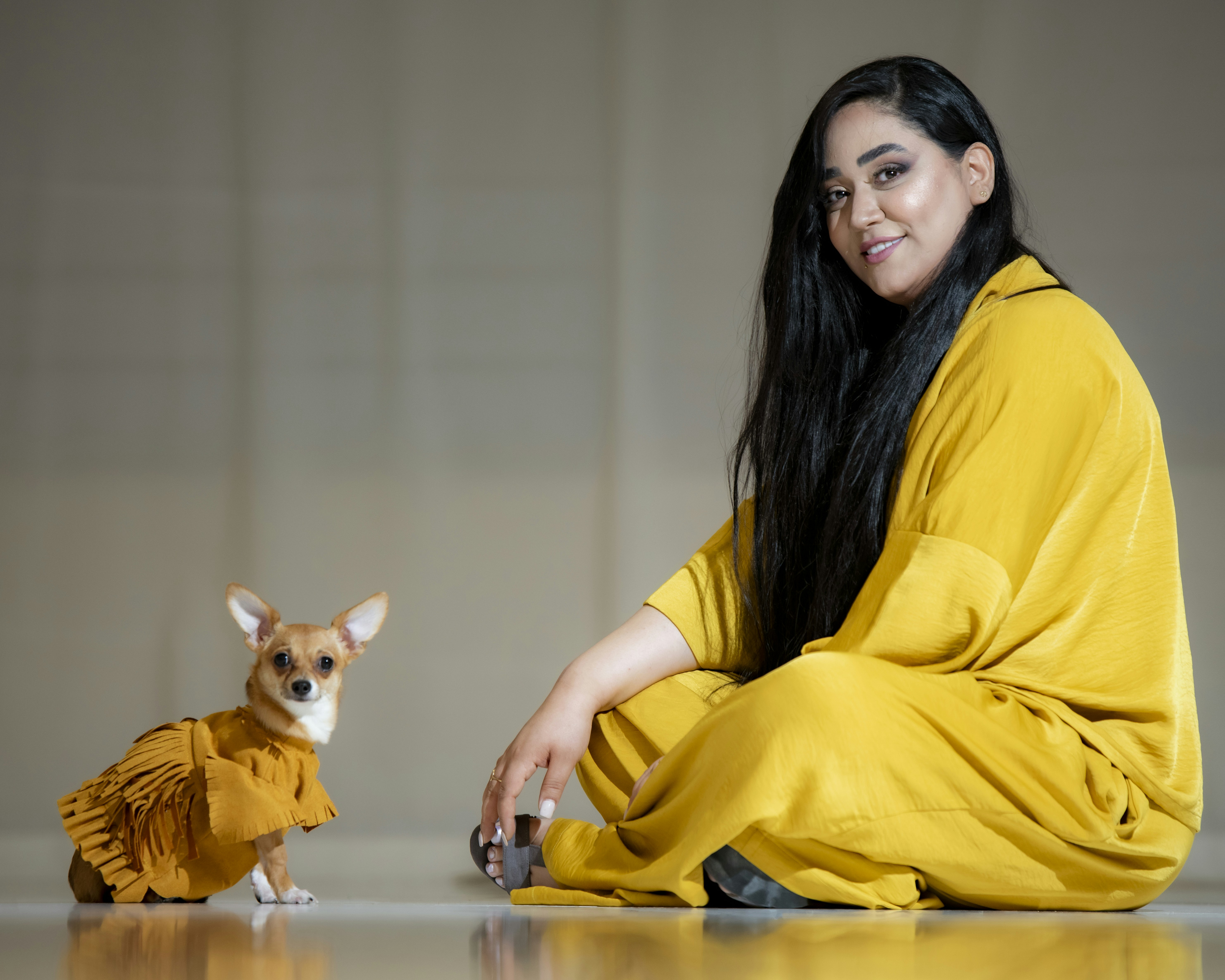 Golden Quiet: Woman in Yellow with a Fringe Companion
