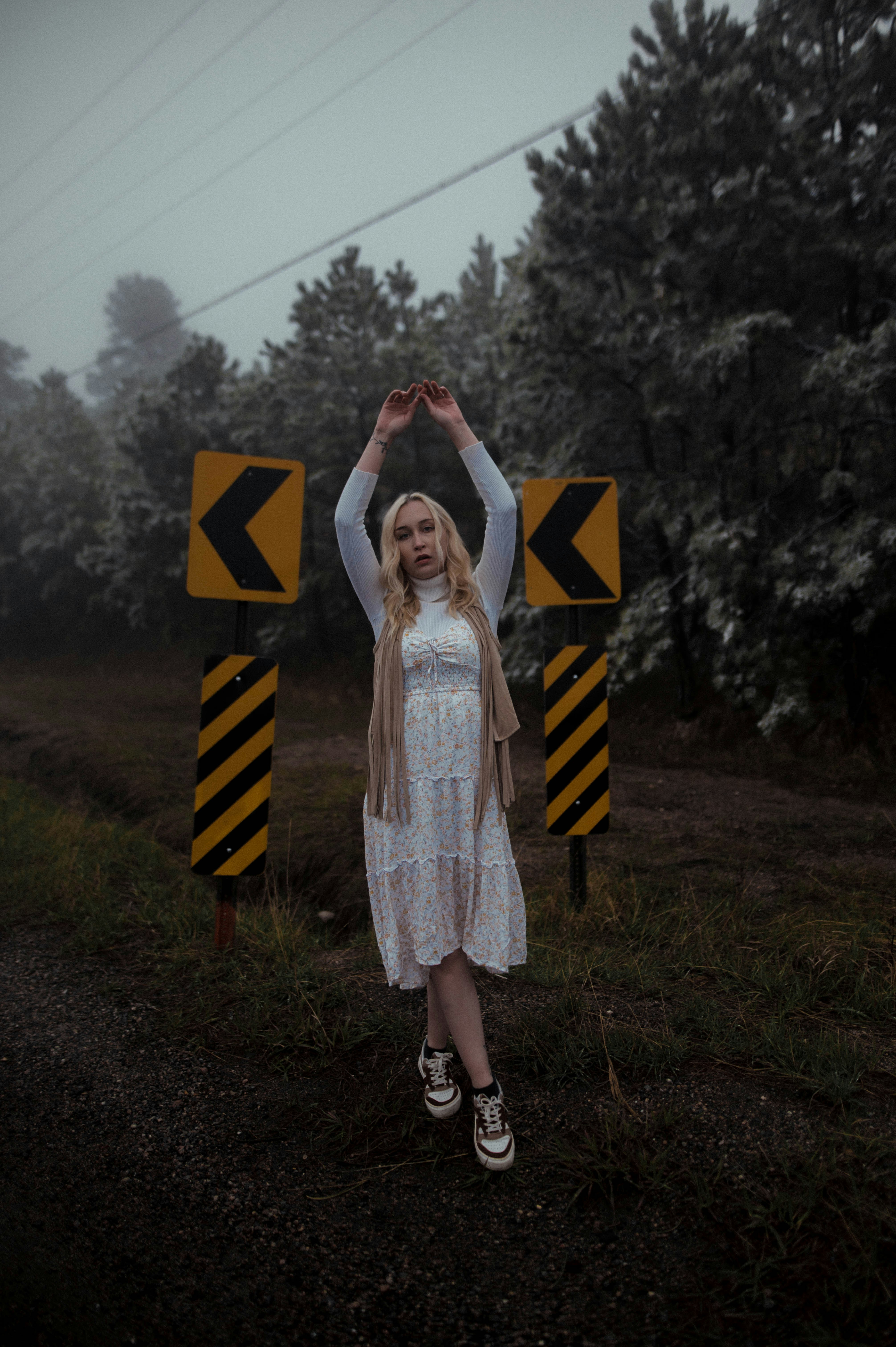 A person standing next to a sign photo – Free Clothing Image on Unsplash
