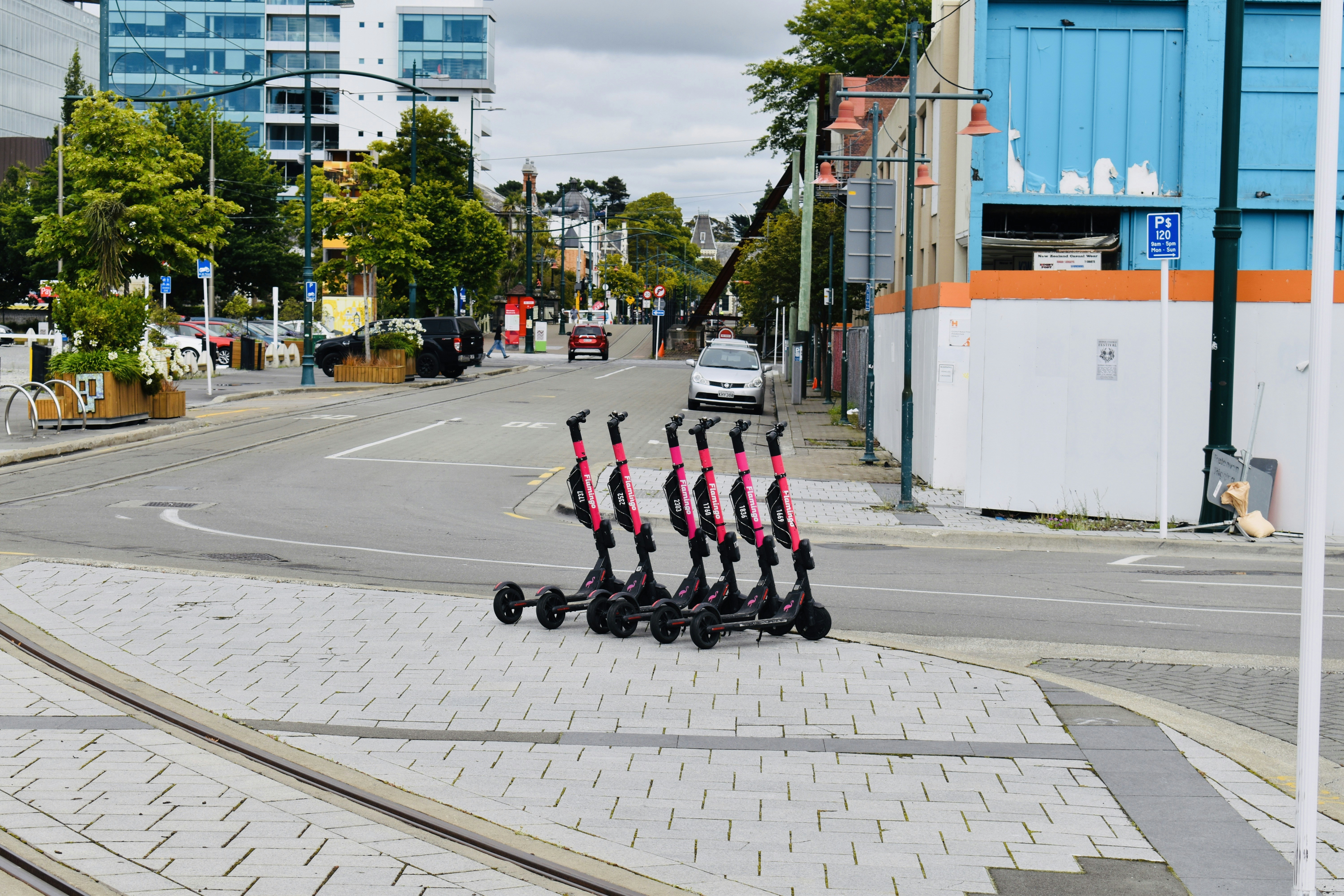 a group of bicycles parked on the side of a street
