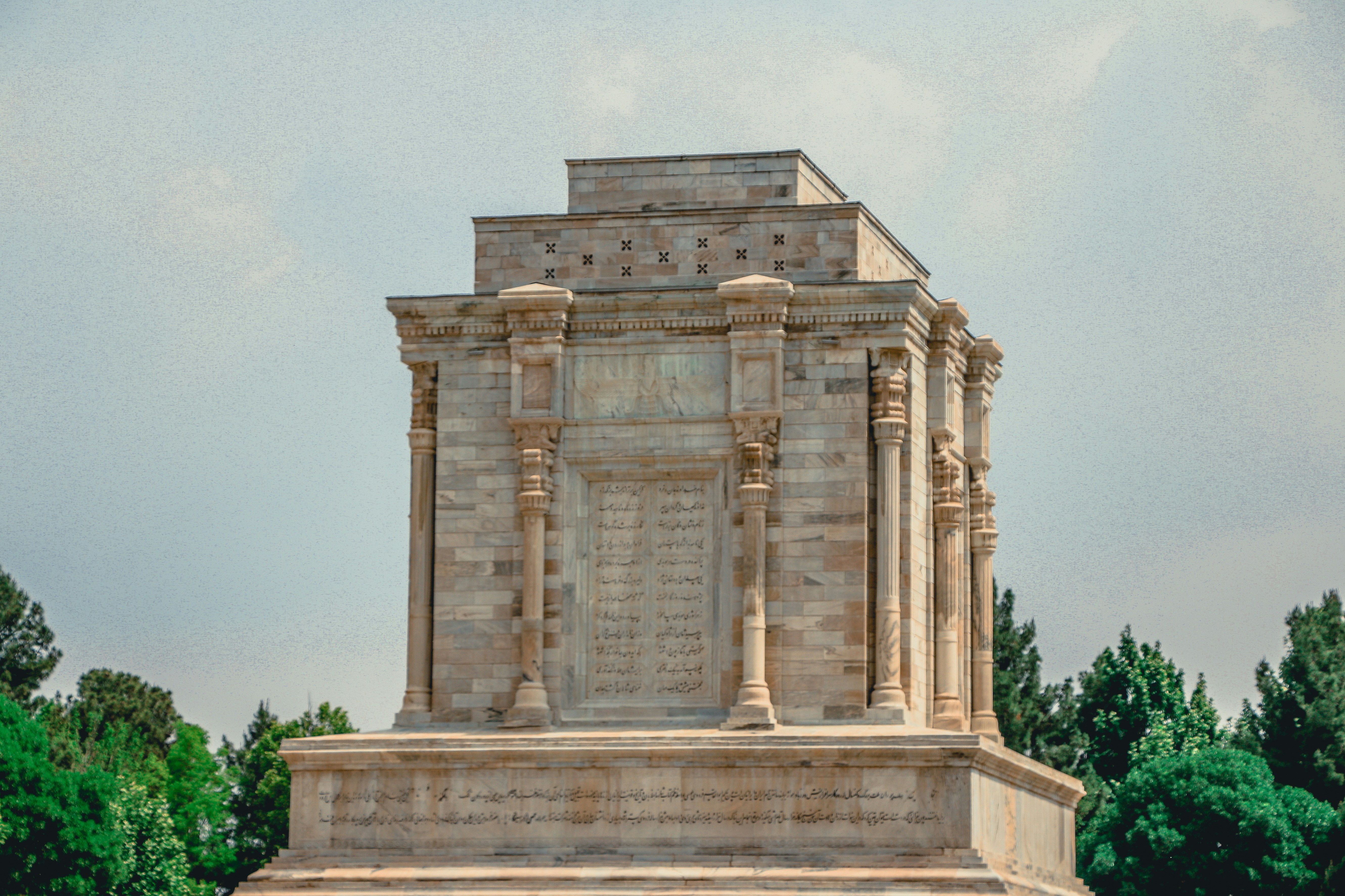 Stone Solstice: Central Panel Framed by Classical Pillars in the Park