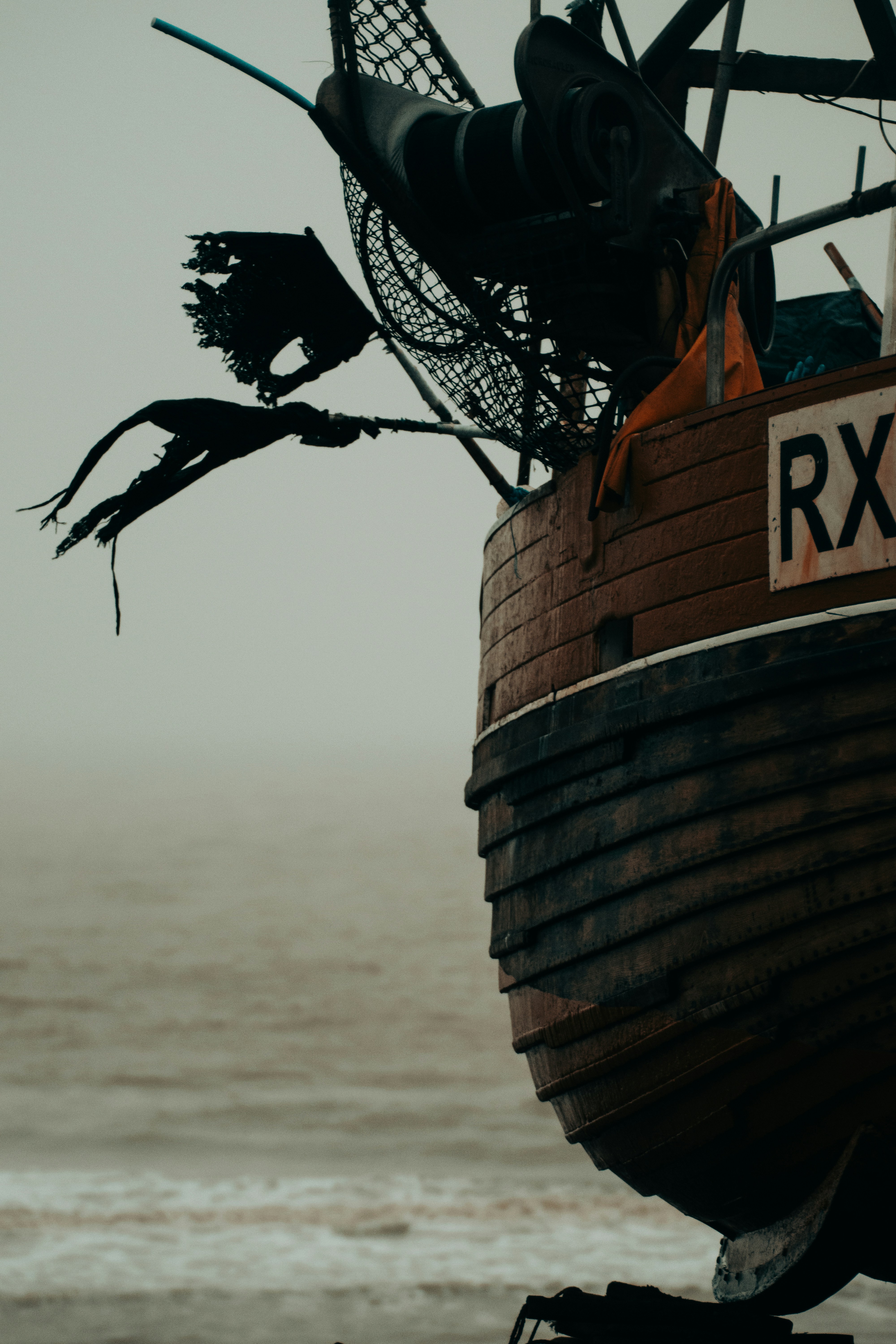 Bow Wreck at the Shore: Weathered Hull Against a Muted Ocean