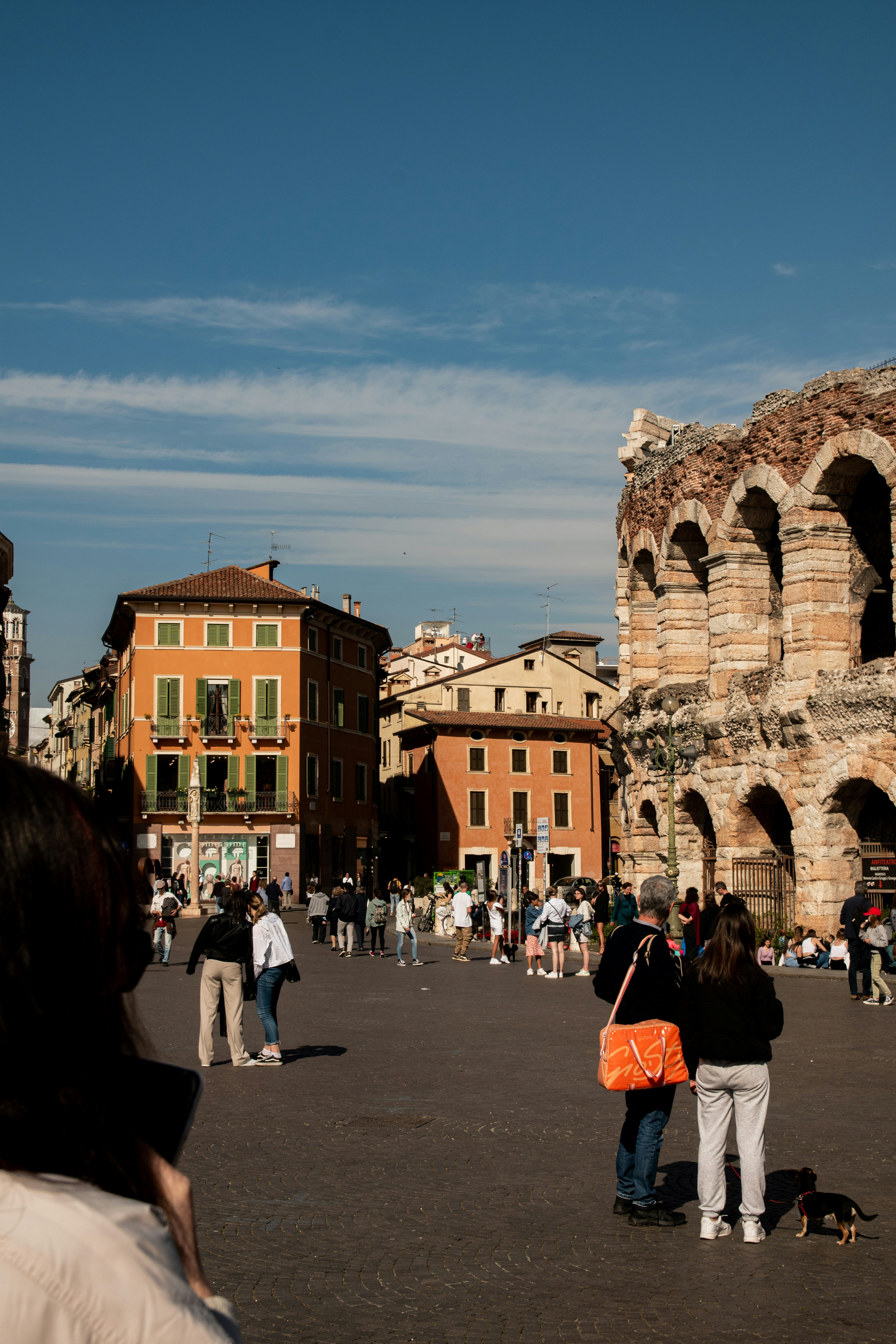 a group of people walking around a city