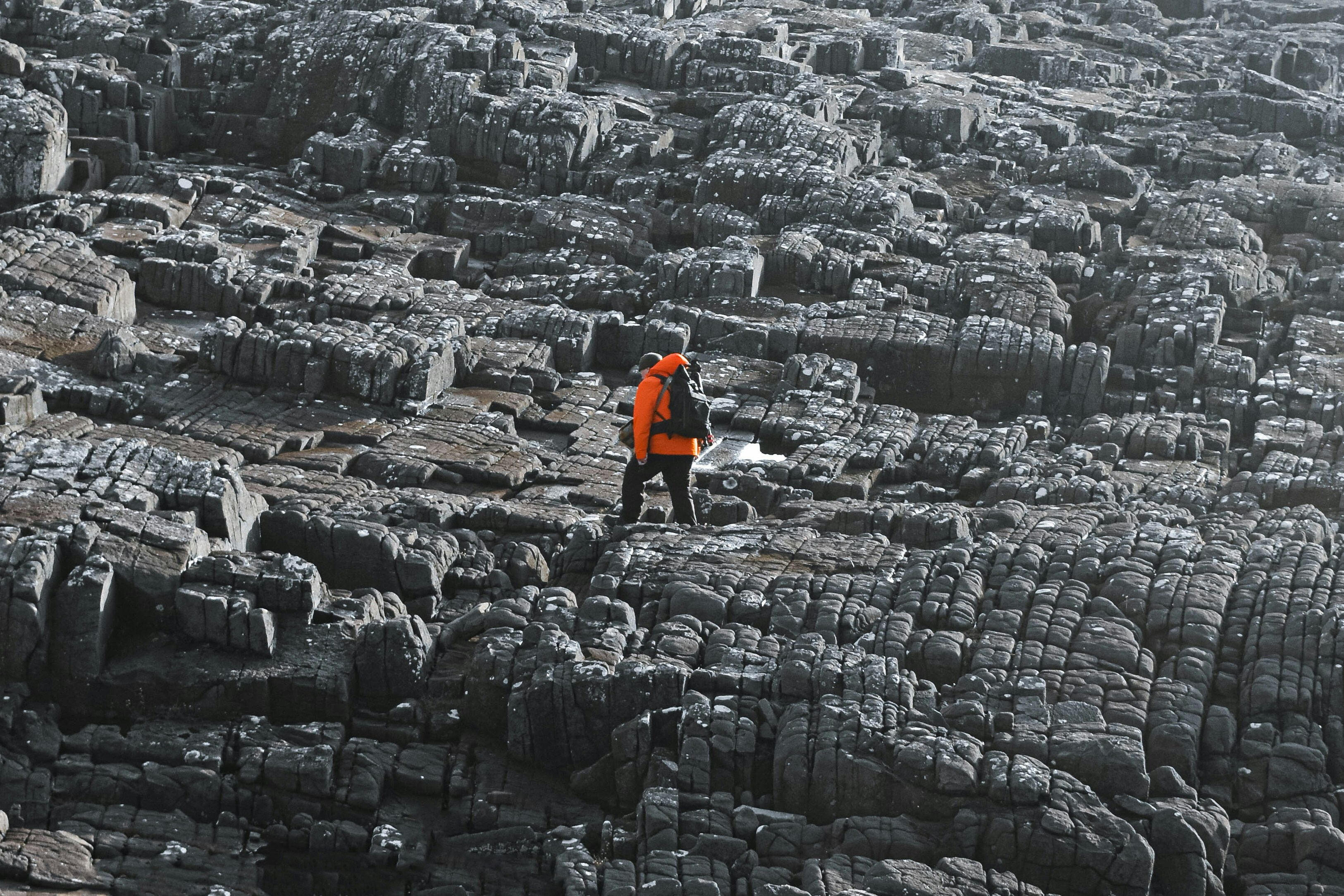 A man standing in a pile of rubble photo – Free Neist point Image on ...
