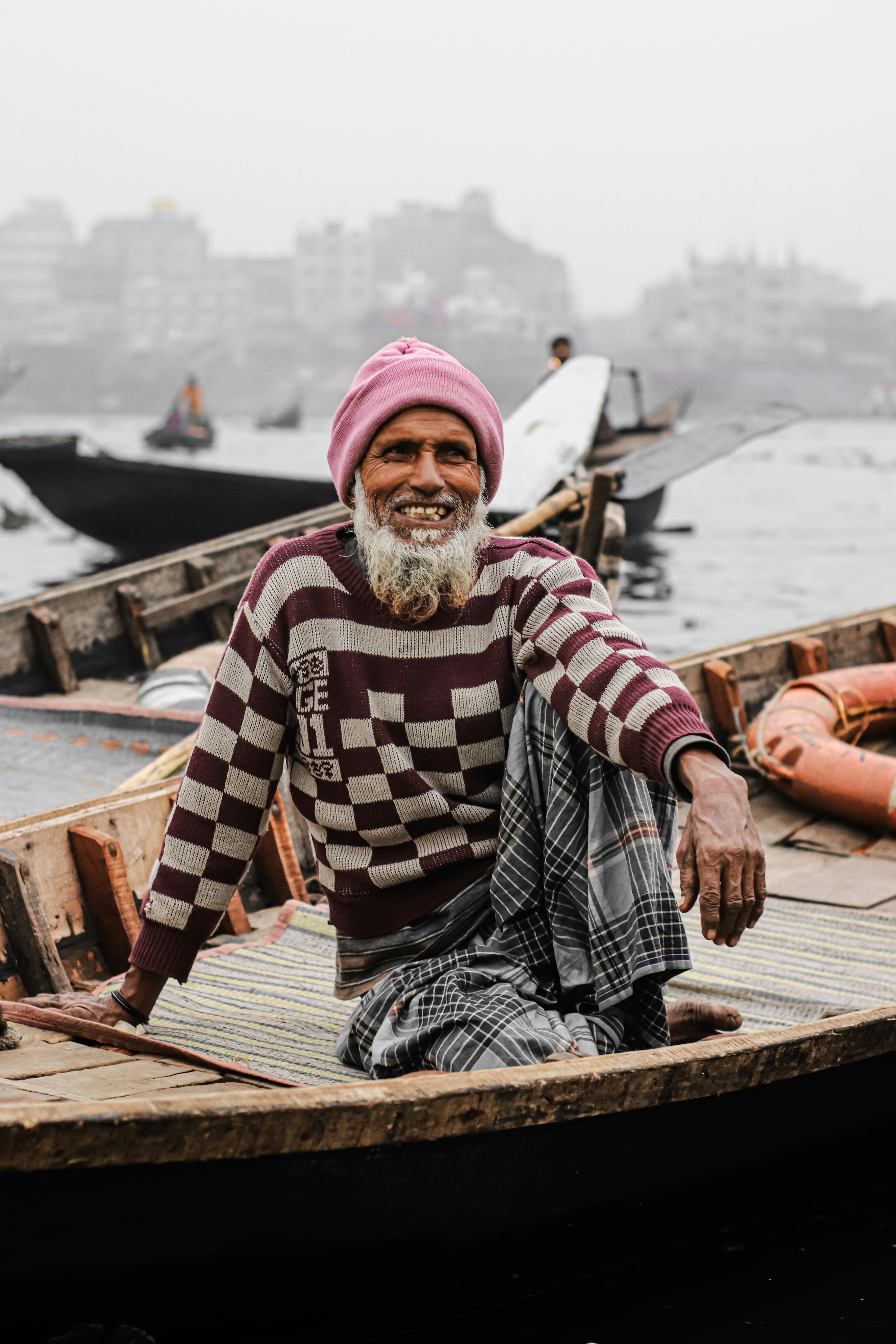 Smiles in a Sea of Boats: A Friendly Portrait on the Ghat