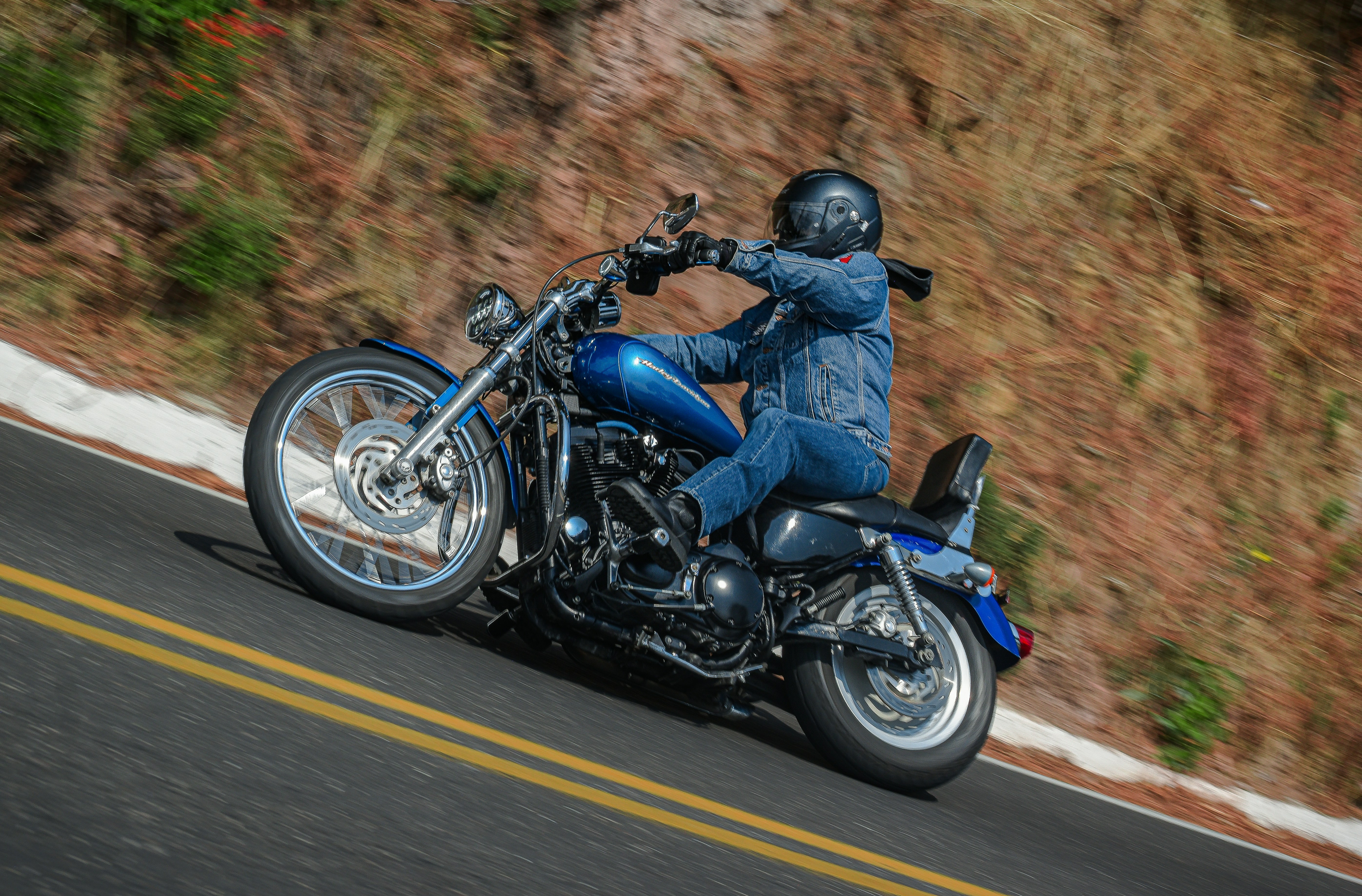 Blue Chrome on the Open Road: A Rider in Motion
