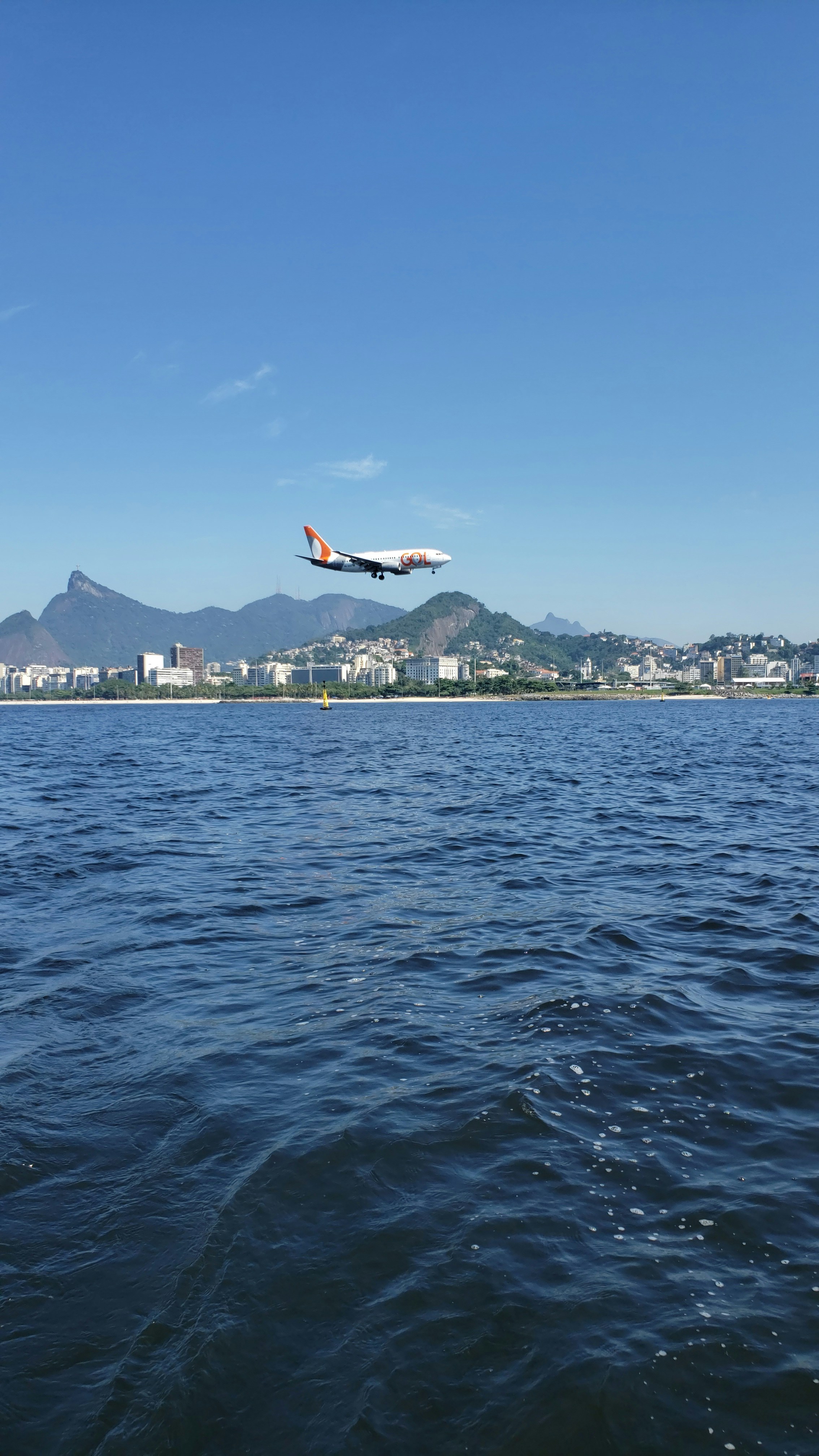 Gol airplane landing in SDU (Santos Dumont) airport in Rio de Janeiro in a sunny day.