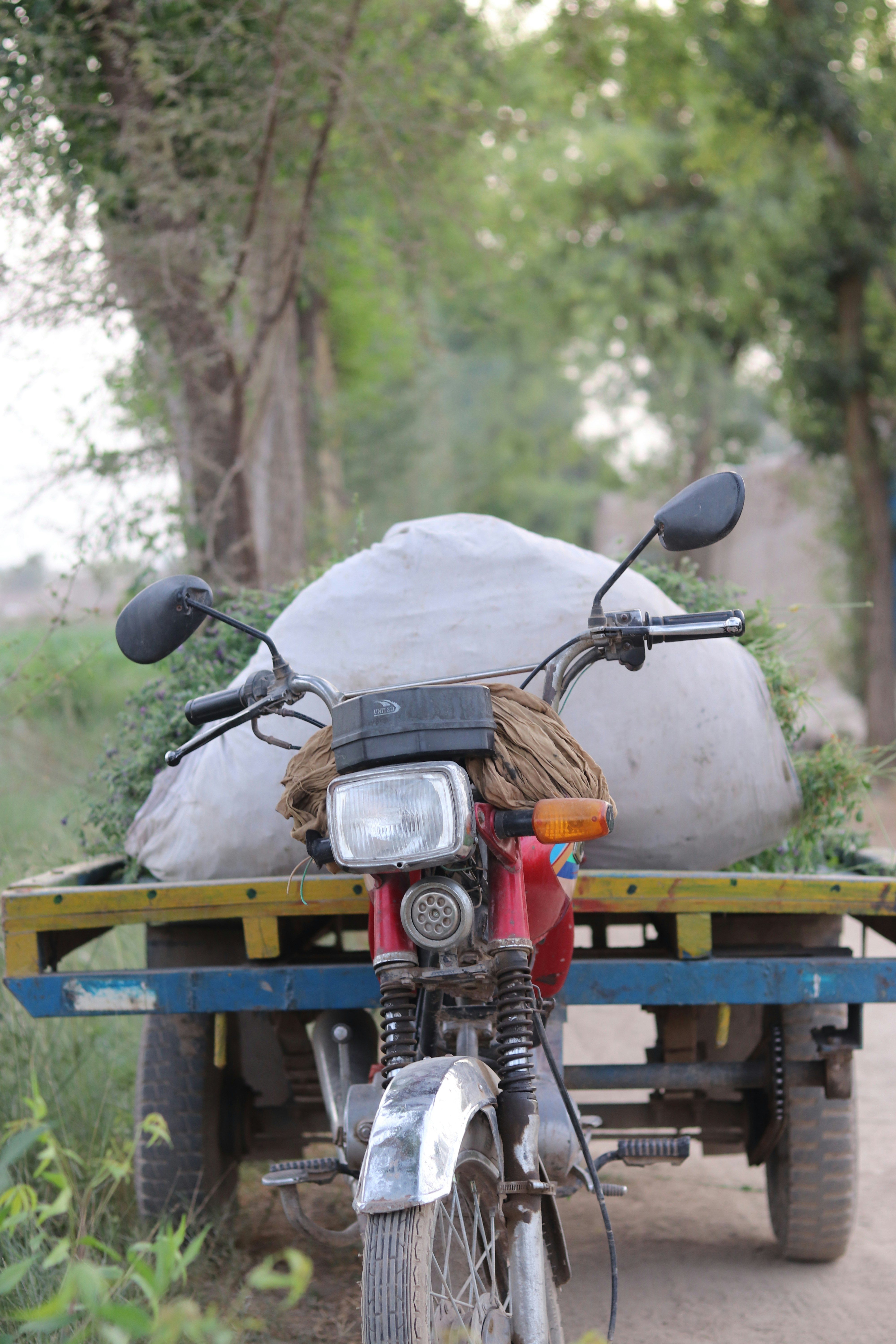 a motorcycle with a cart attached to it