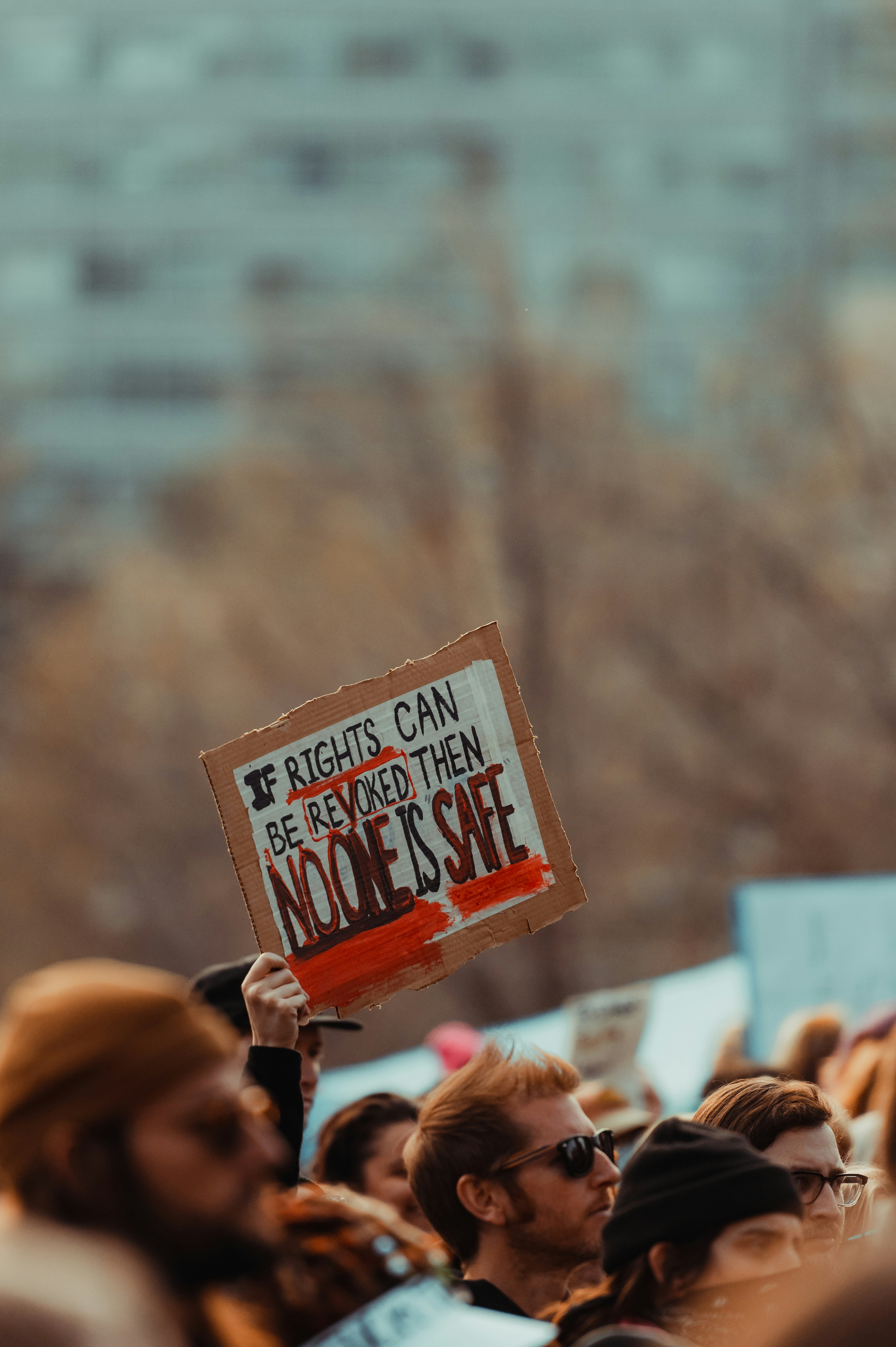 A person holding a sign photo – Free Co Image on Unsplash