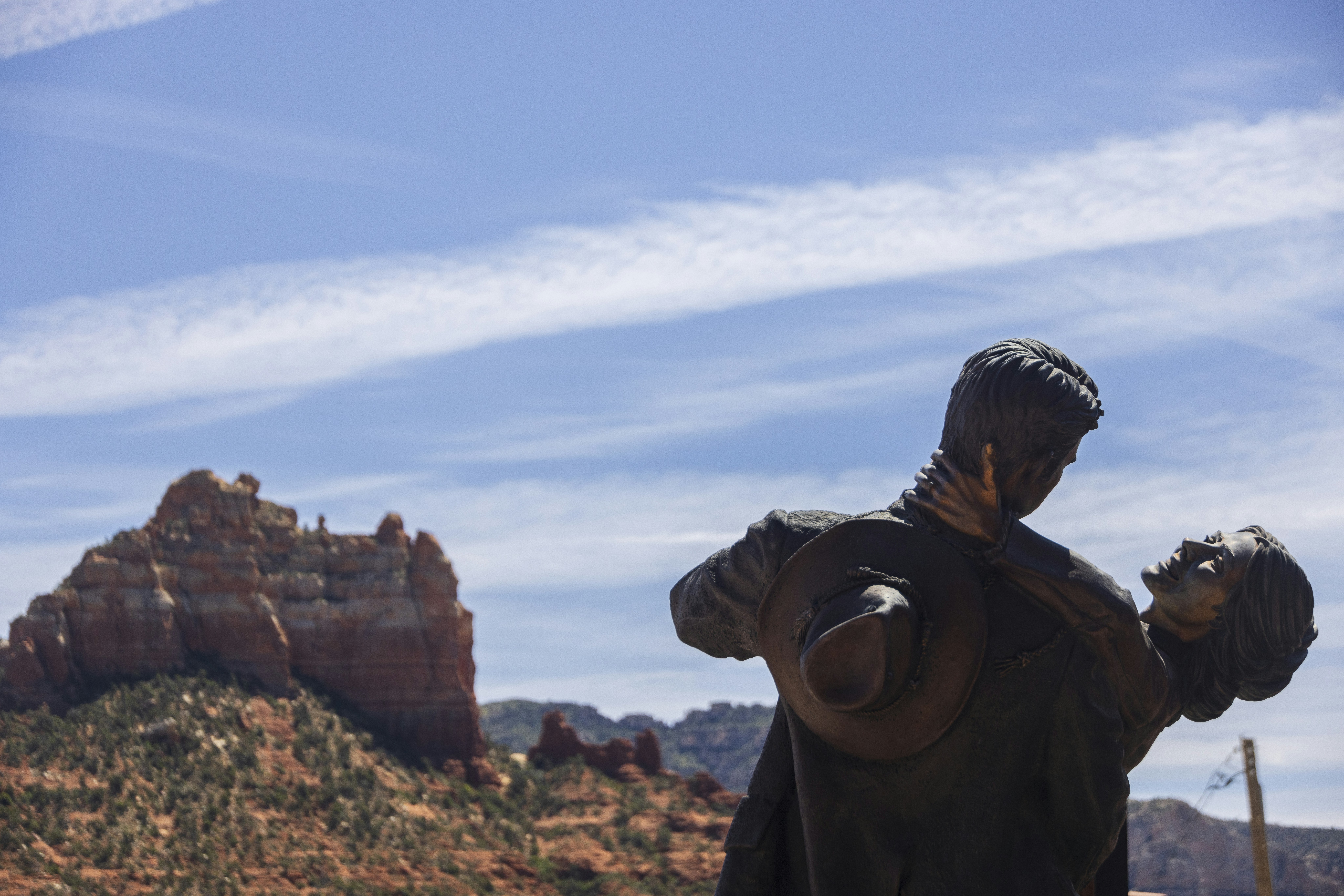 Bronze Embrace Against the Red Rock Horizon