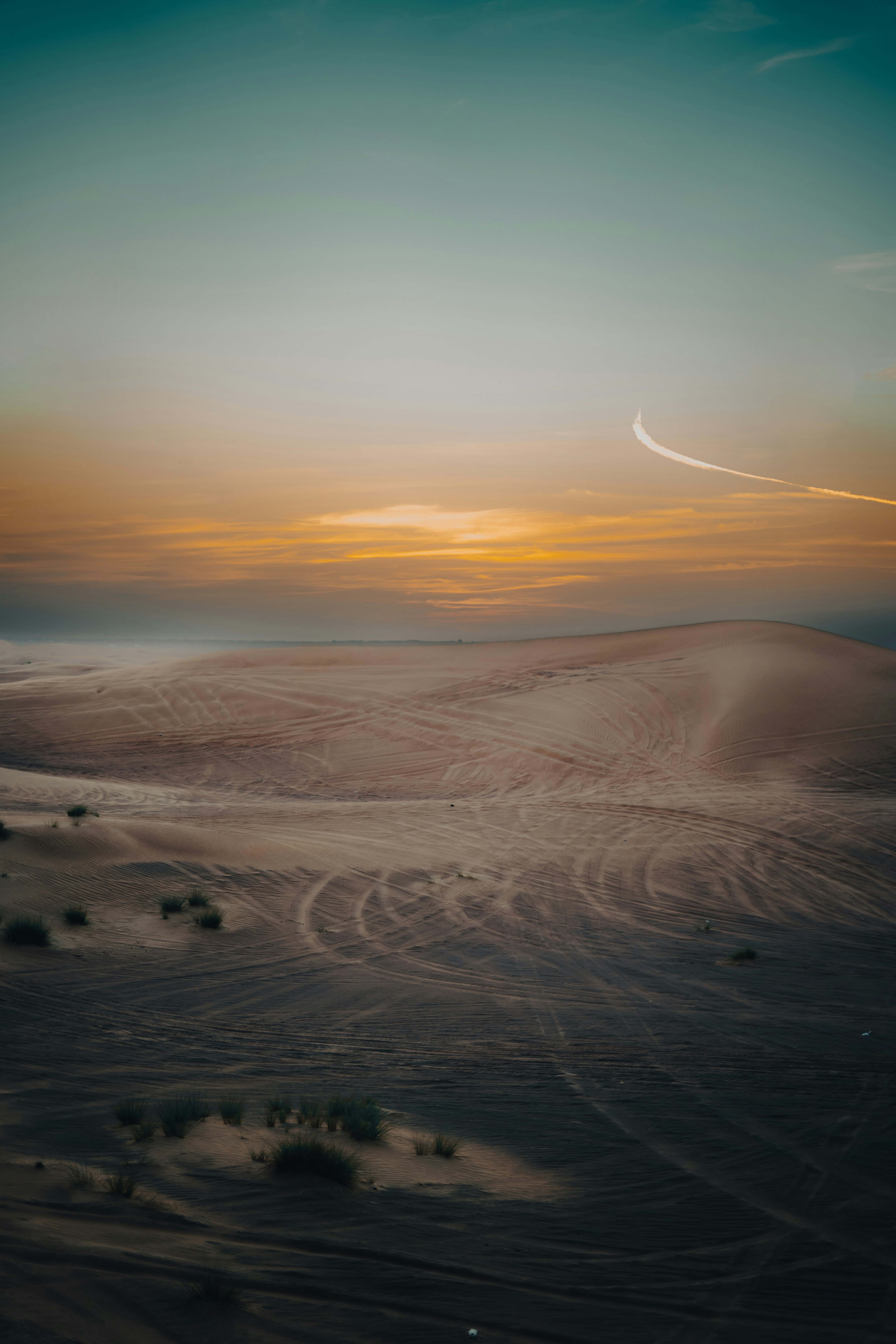 A desert landscape with a trail of smoke photo – Free Soil Image on ...