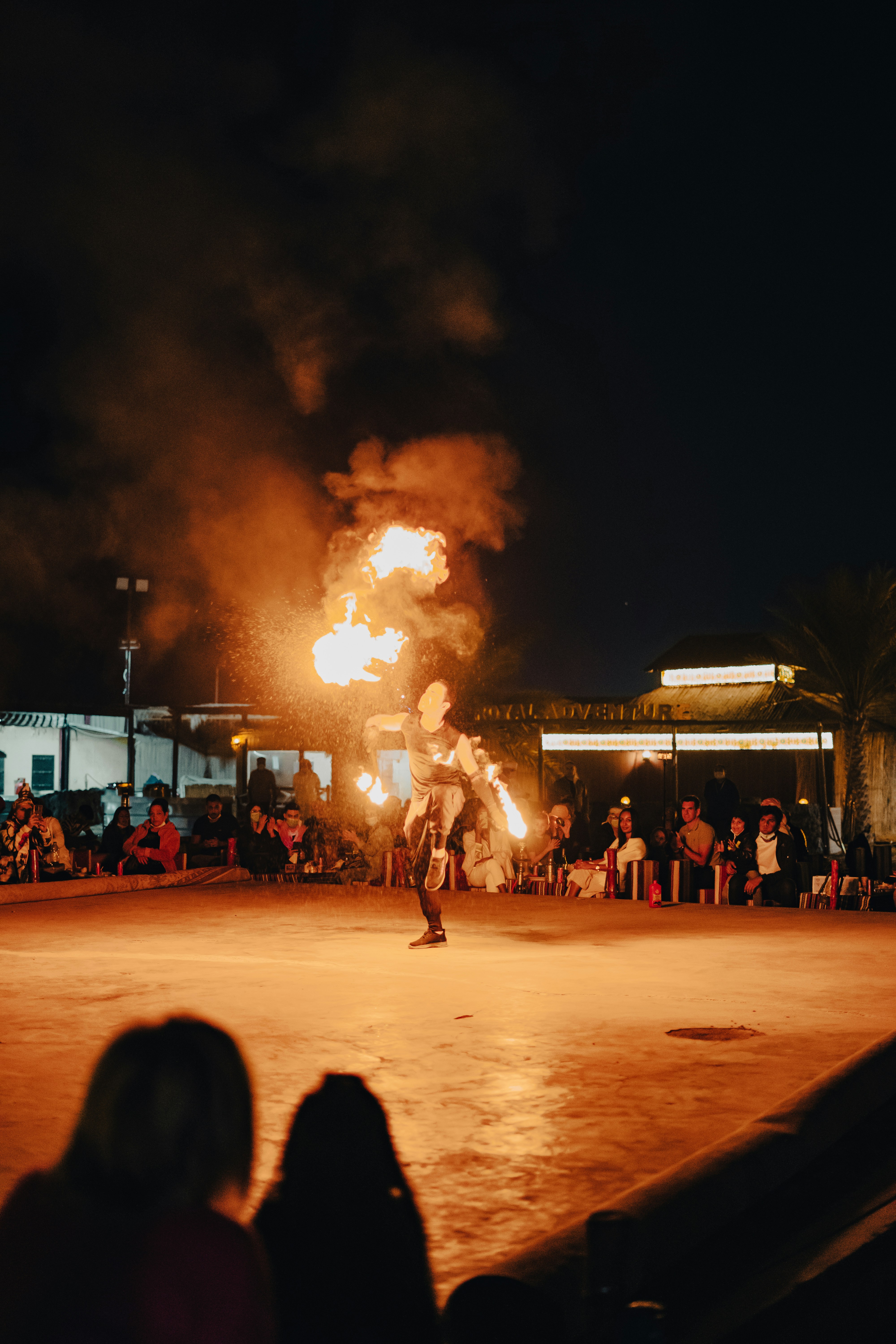 A group of people watching a person on fire photo – Free Brown Image on ...