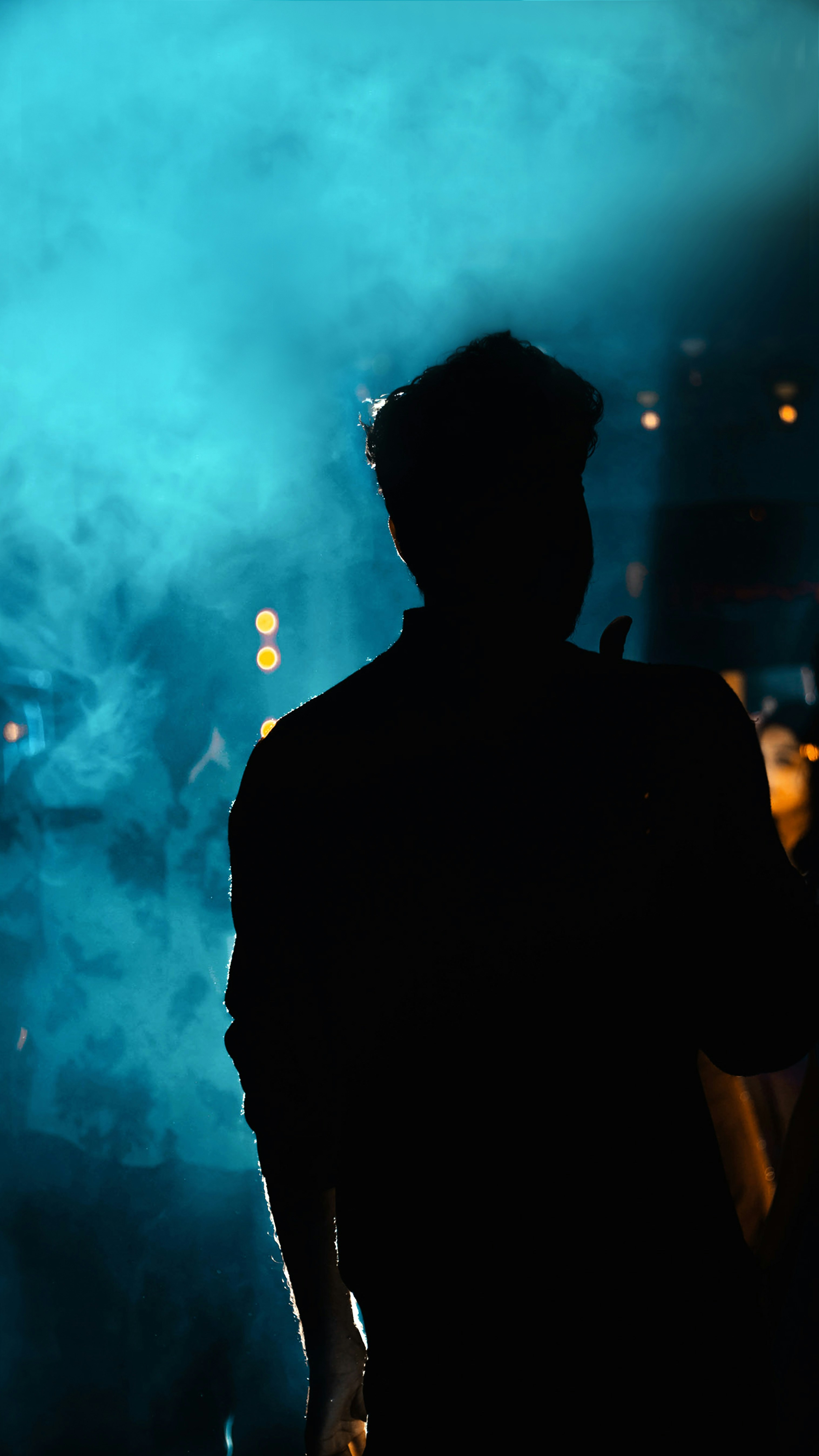 A person standing in front of a bright light photo – Free Blue Image on ...