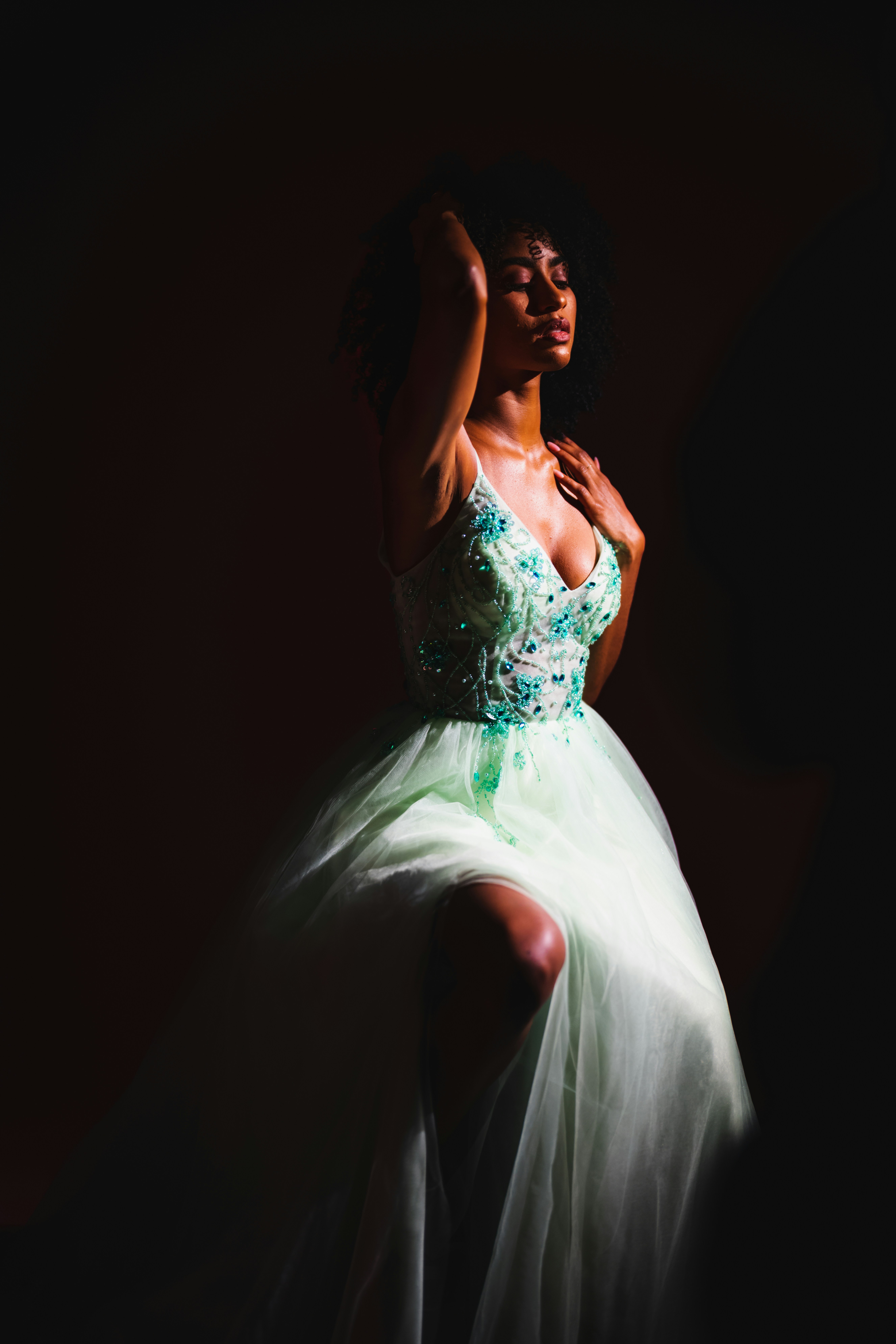 Emerald Silhouette Under Velvet Spotlight