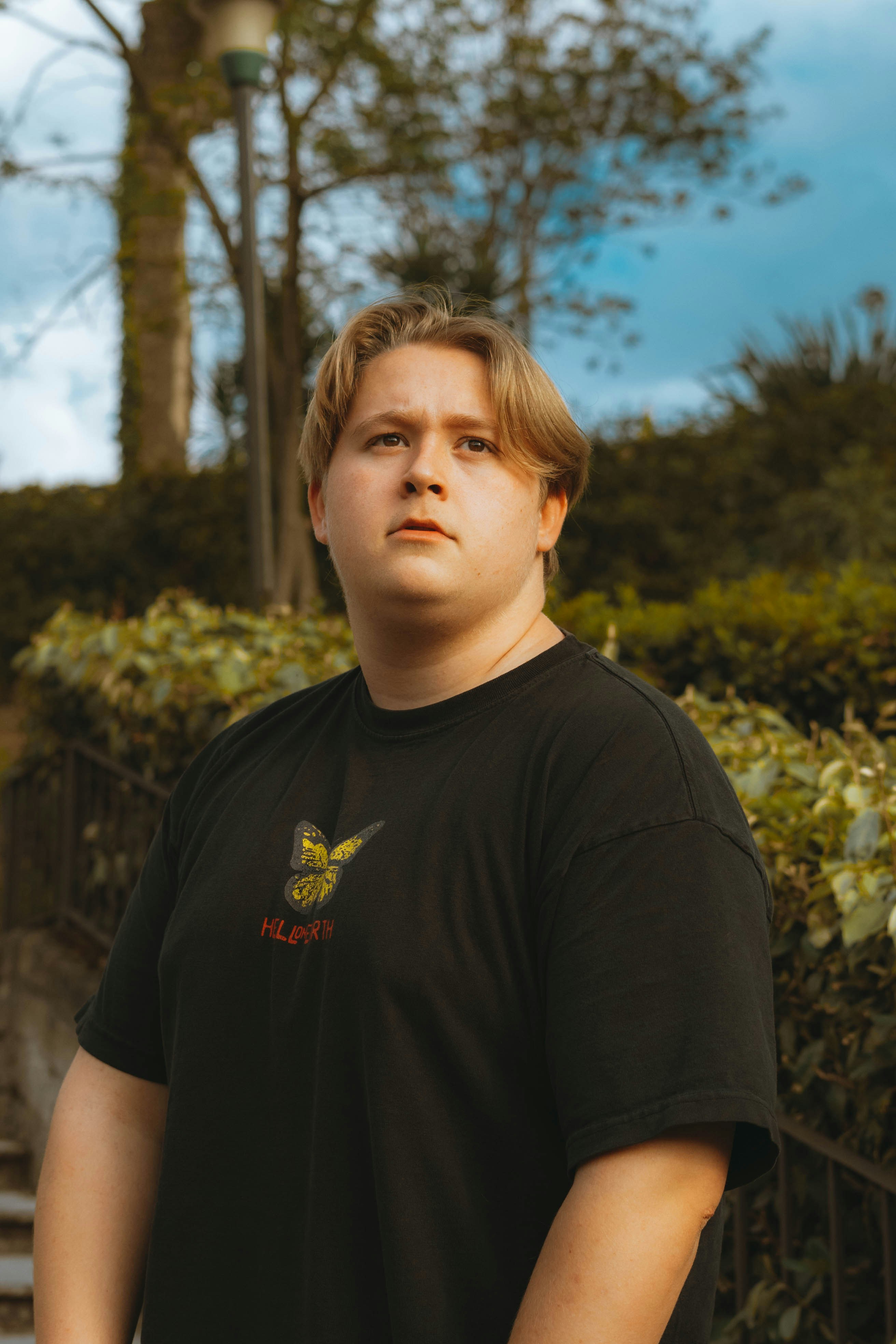 Sunlit Gaze in a Garden Hedge Portrait