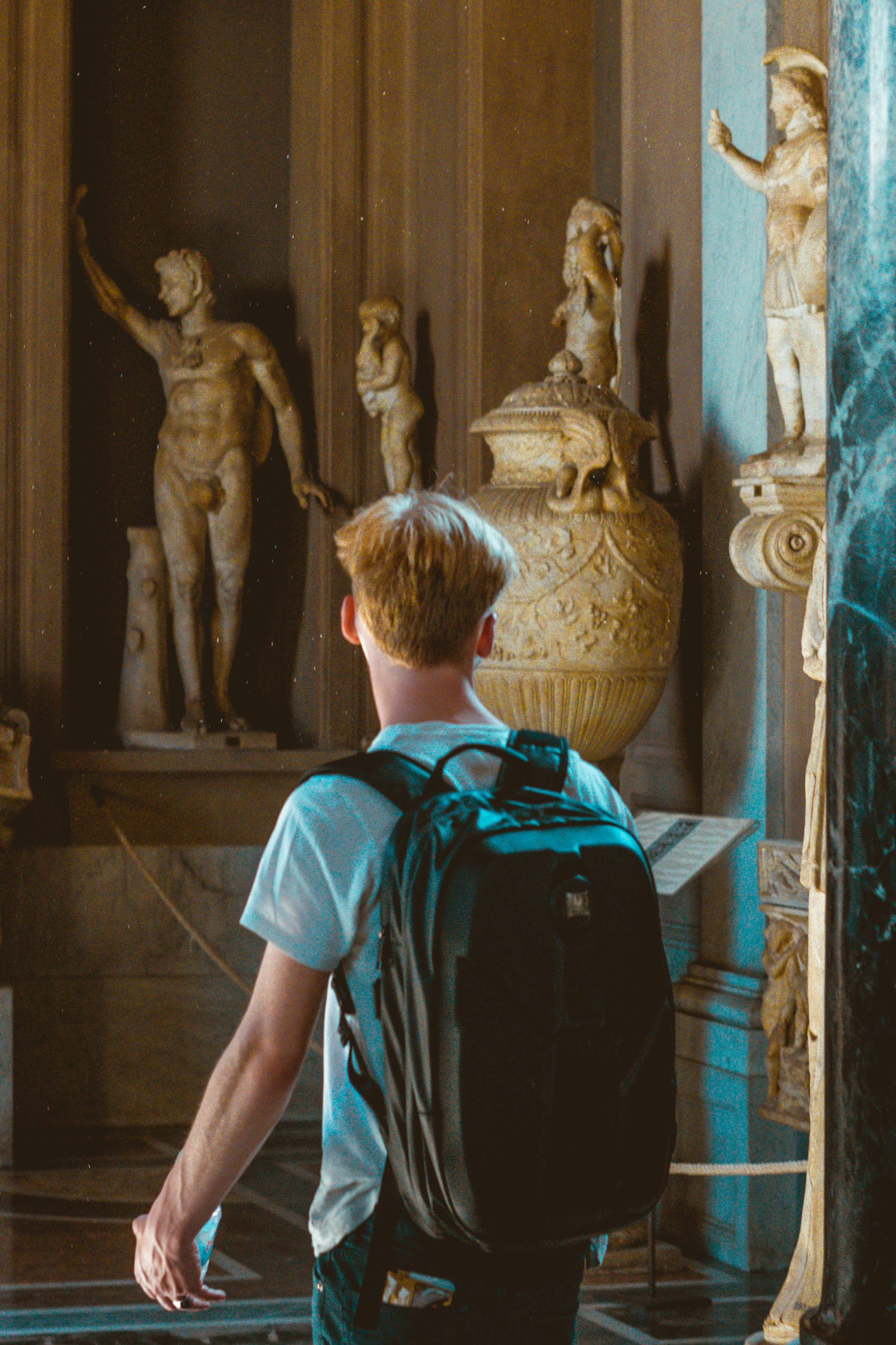 A boy looking at statues photo – Free Human Image on Unsplash