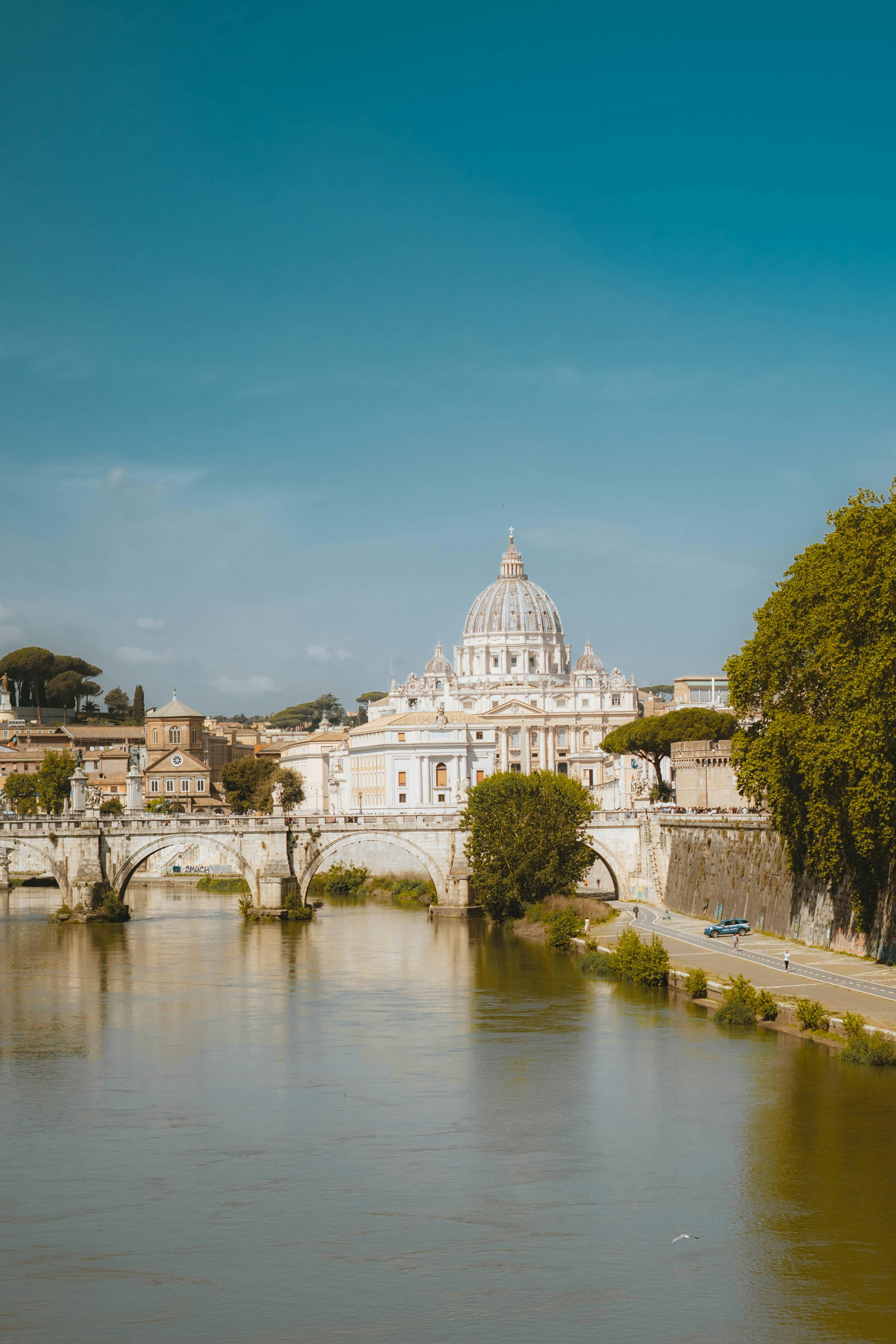 Tiber over a river leading to a large white building photo – Free ...