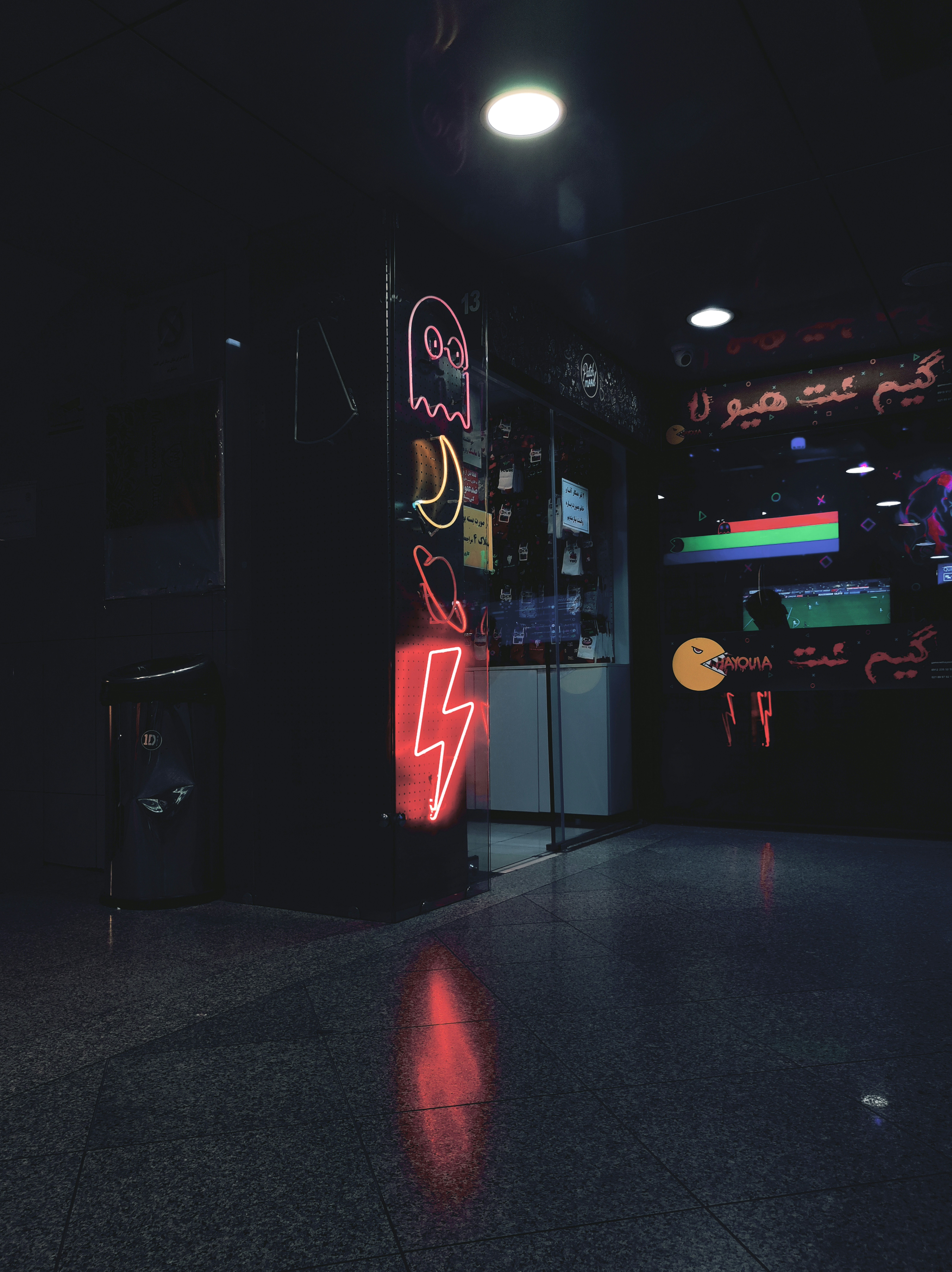 Somewhere to play. | a building with neon signs