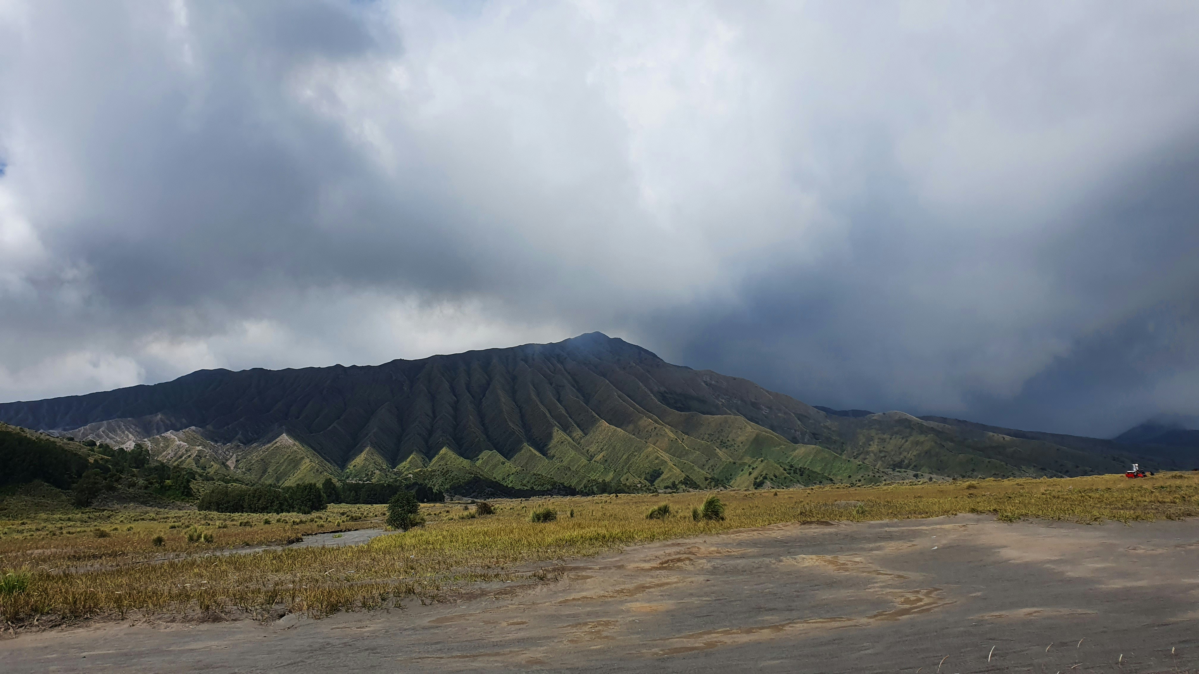 Verdant Ridge Beneath a Brooding Sky