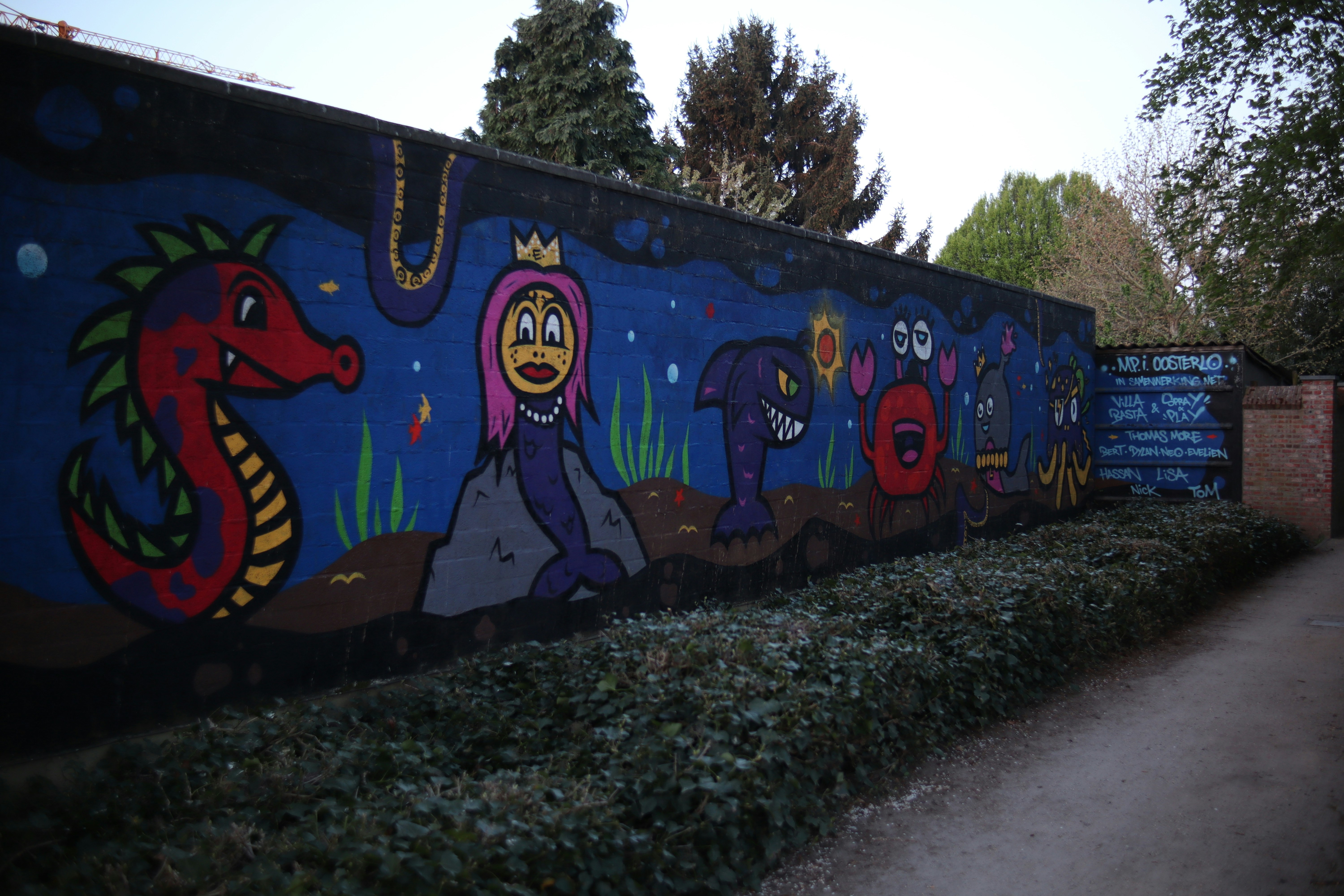 Dragons, Crowns, and Alley Art: A Bold Mural Scene