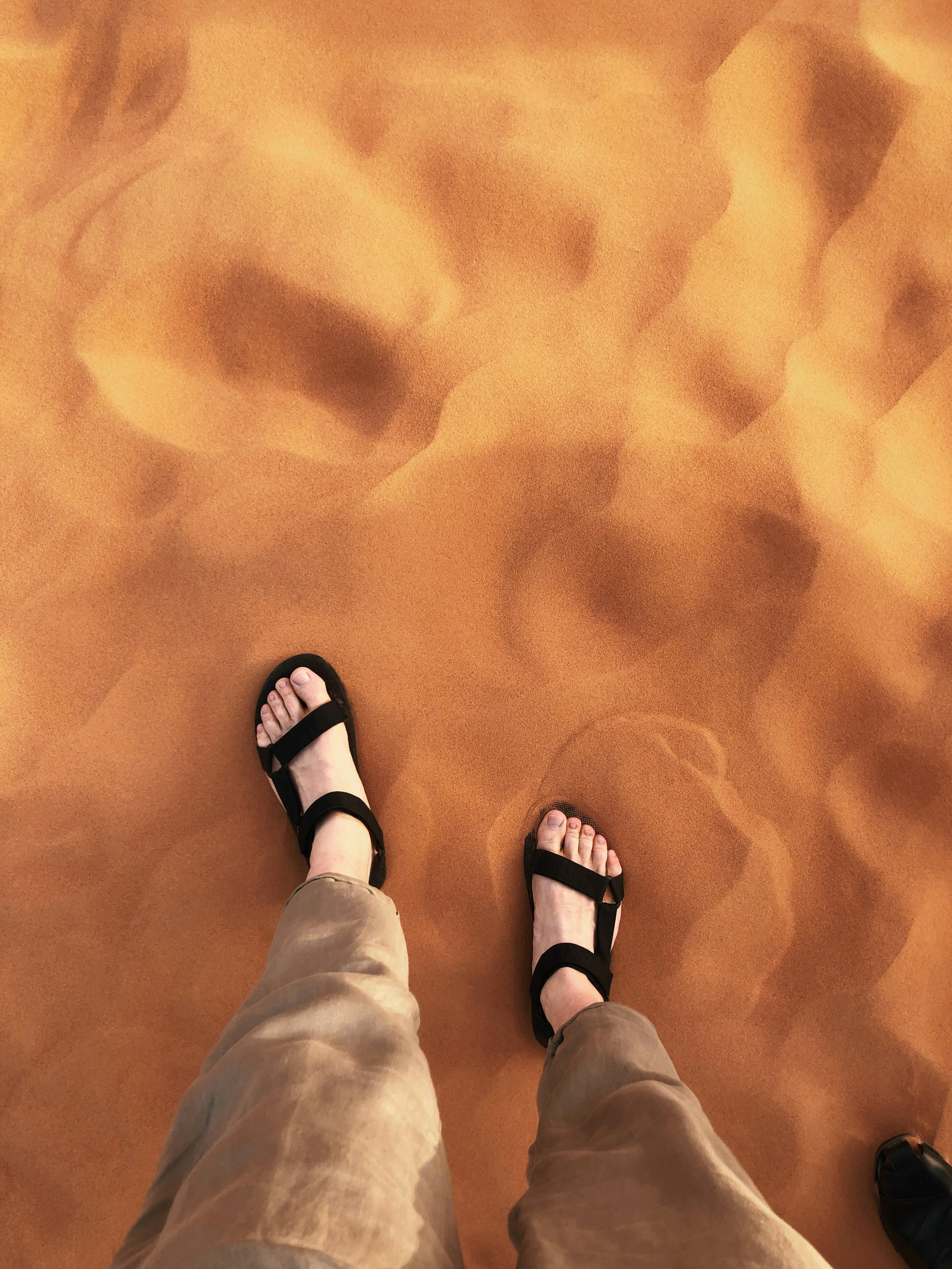 Underfoot in Orange Dunes: A Top-Down Sandal Portrait