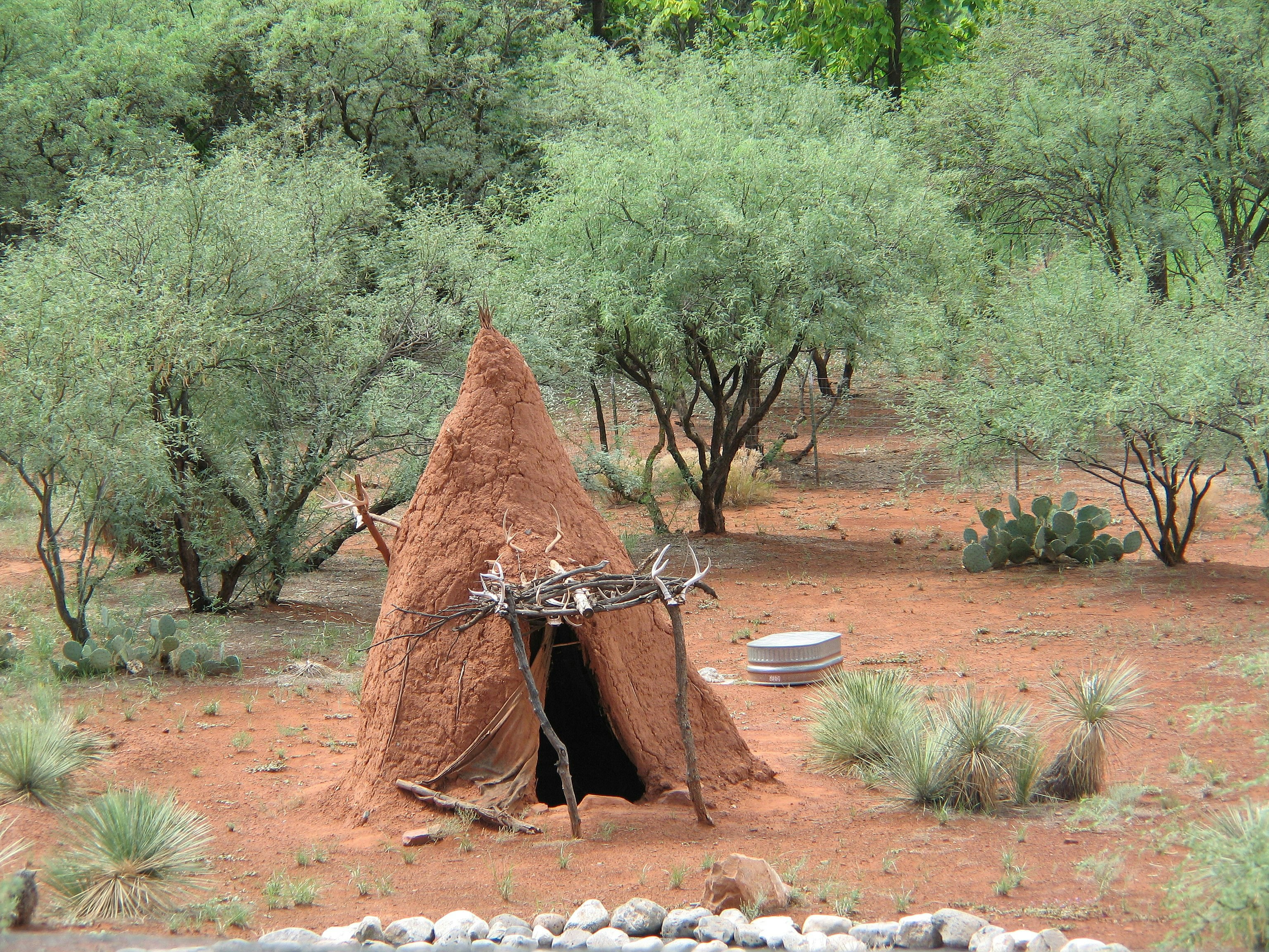Clay-Toned Teepee in a Sparse Red Desert Clearing