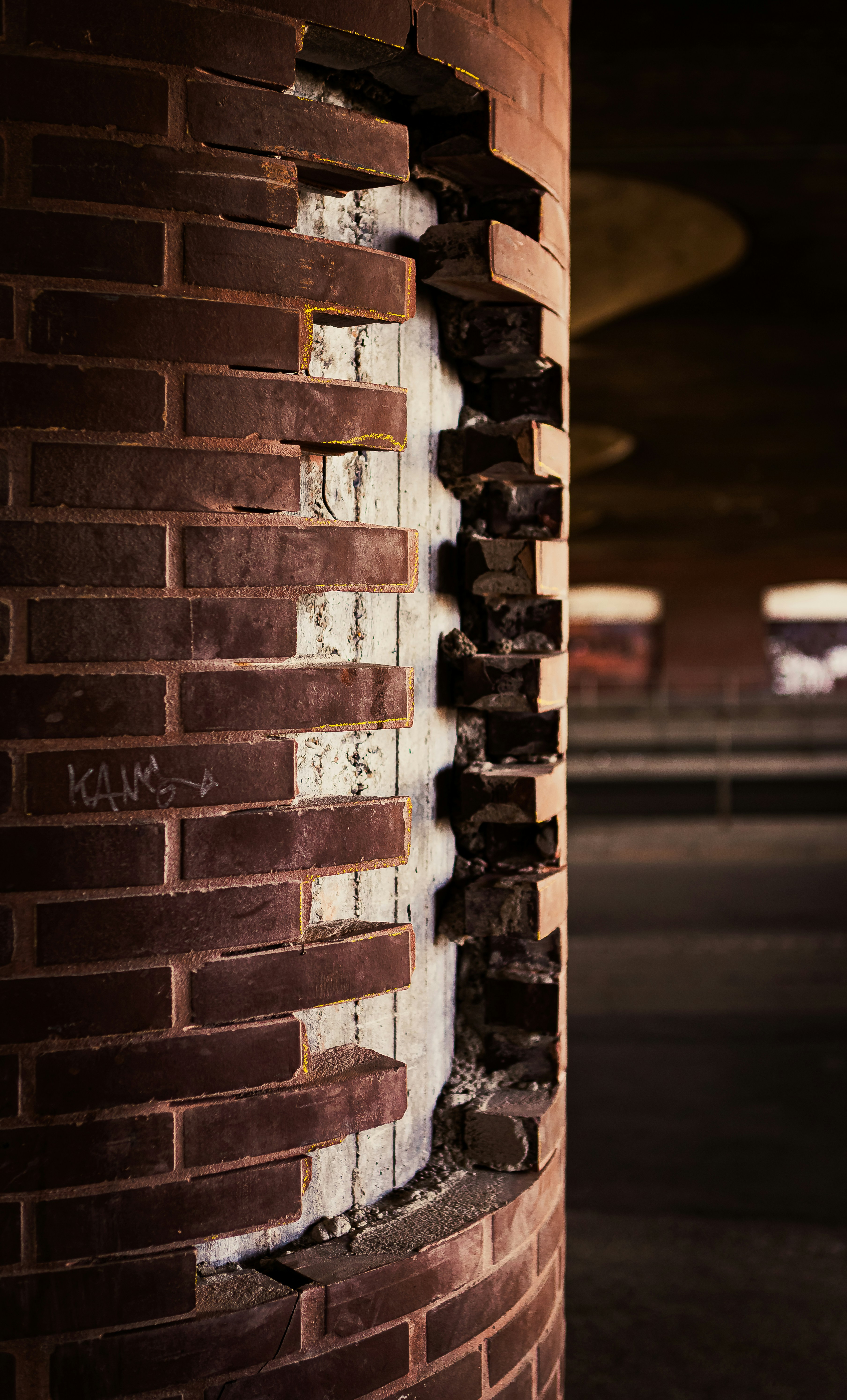 a brick wall with a sign on it