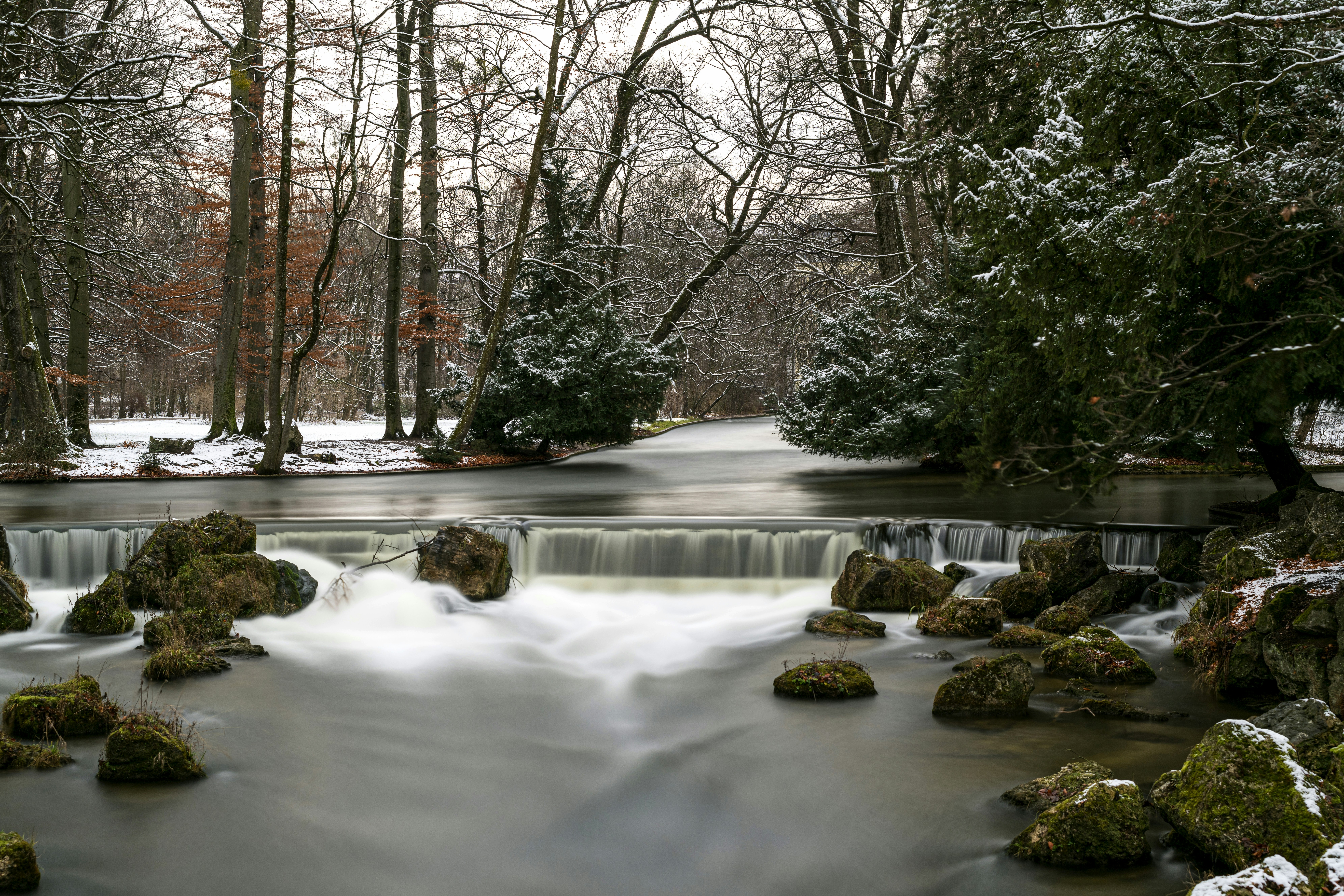 Winter Cascade Over Mossy Rocks