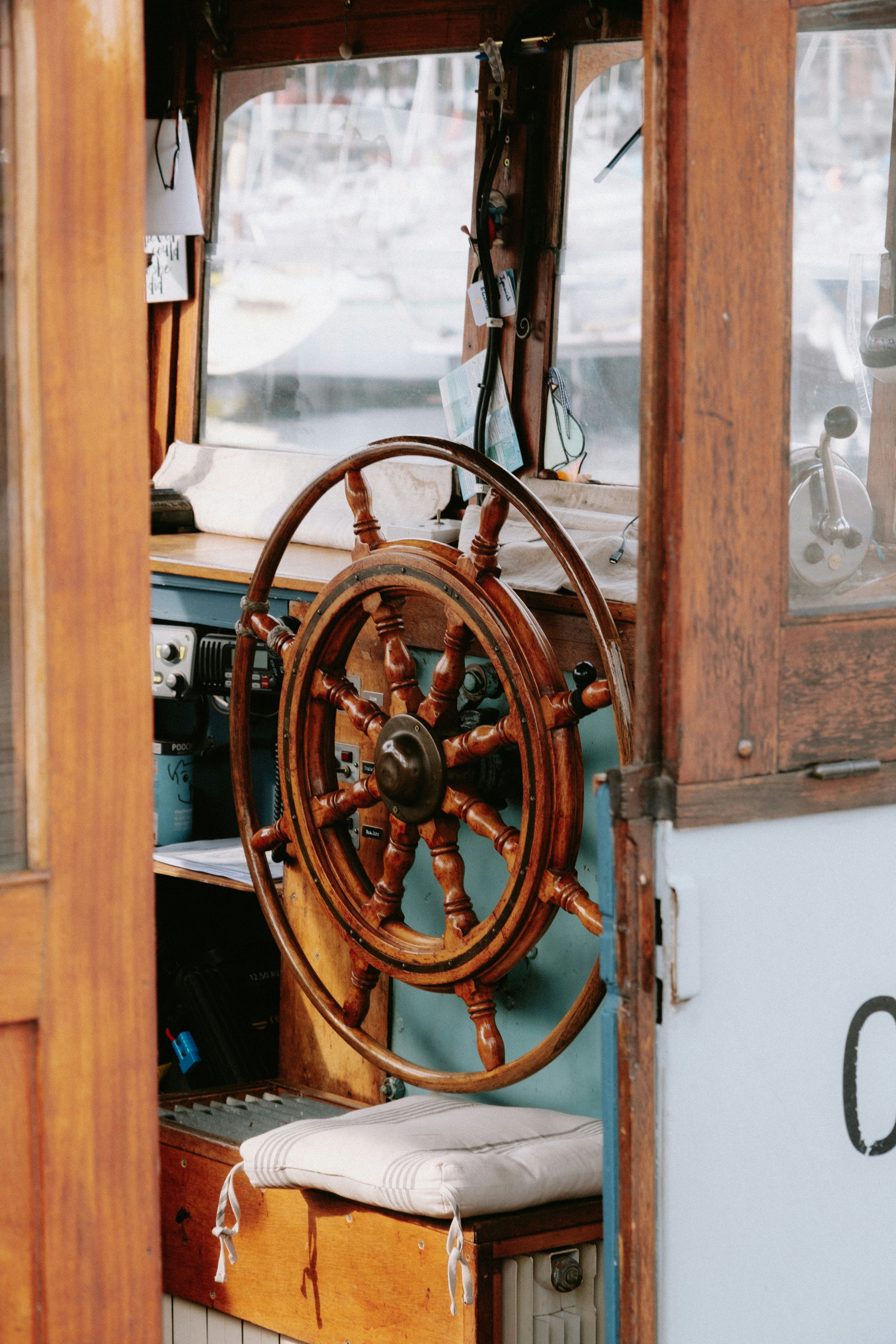 Weathered Helm: The Wheelhouse of a Sailboat