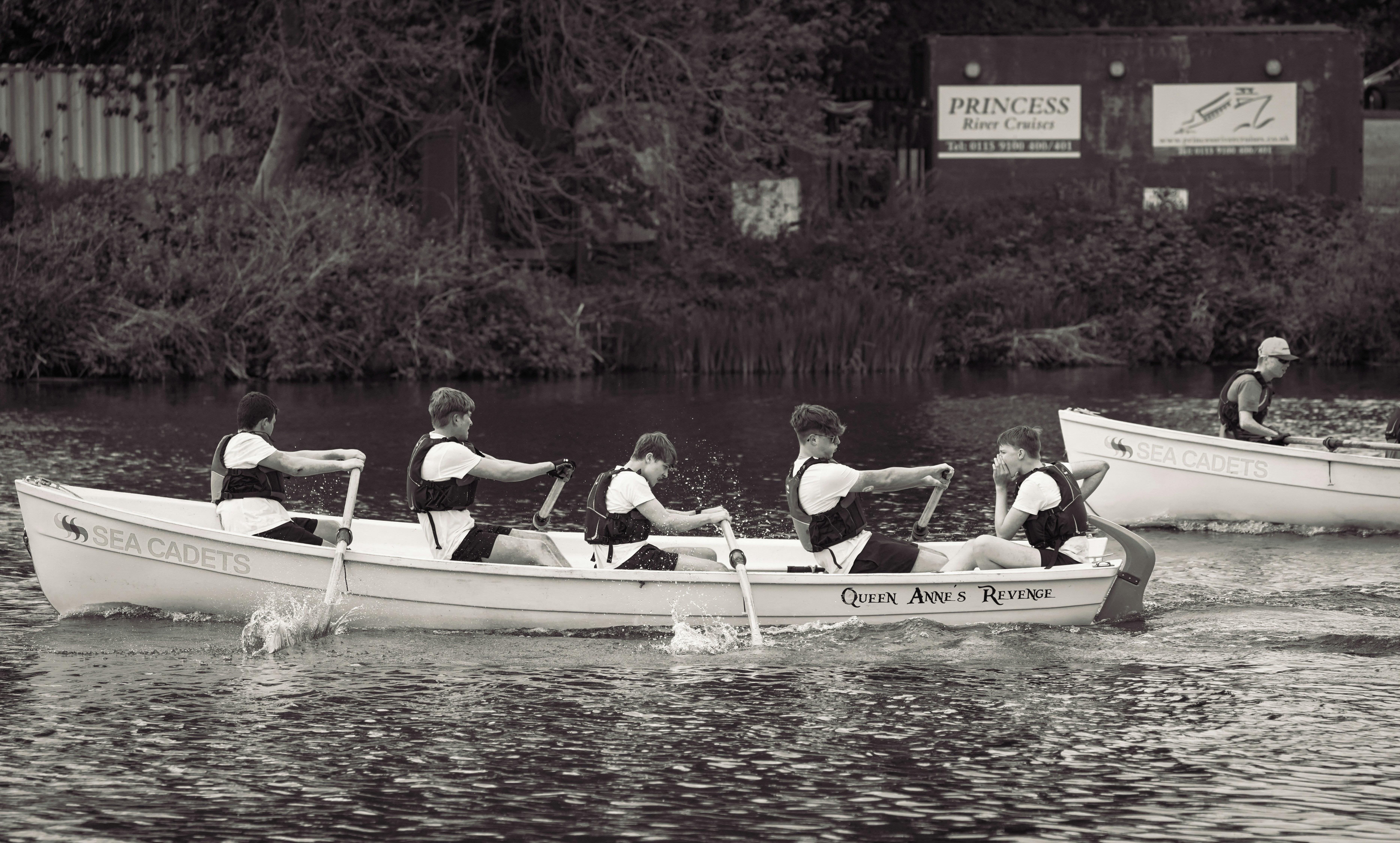 A group of people rowing a boat photo – Free Grey Image on Unsplash
