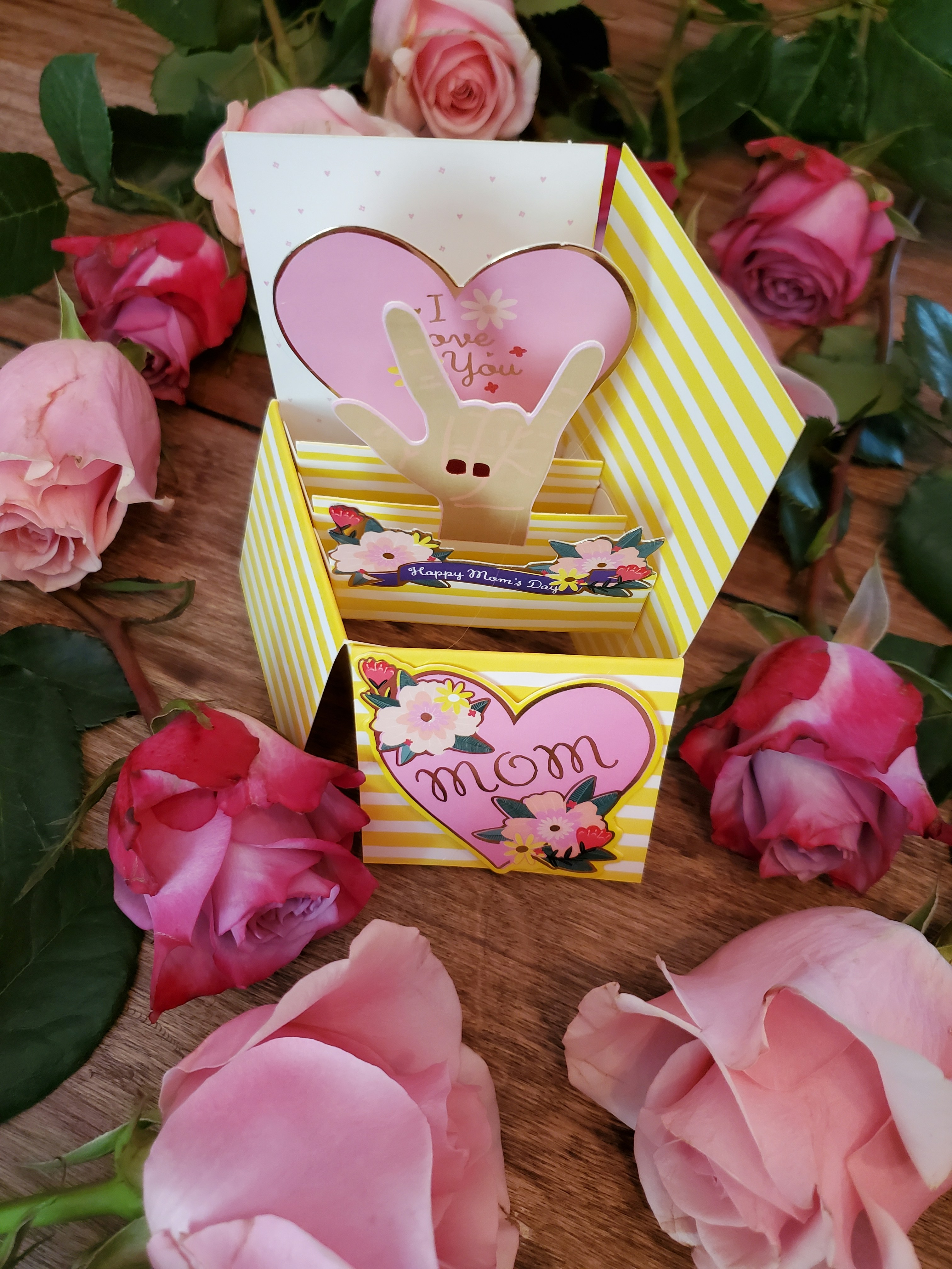Bouquet Surprise: A Colorful Pop-Up Card Scene Among Pink Roses