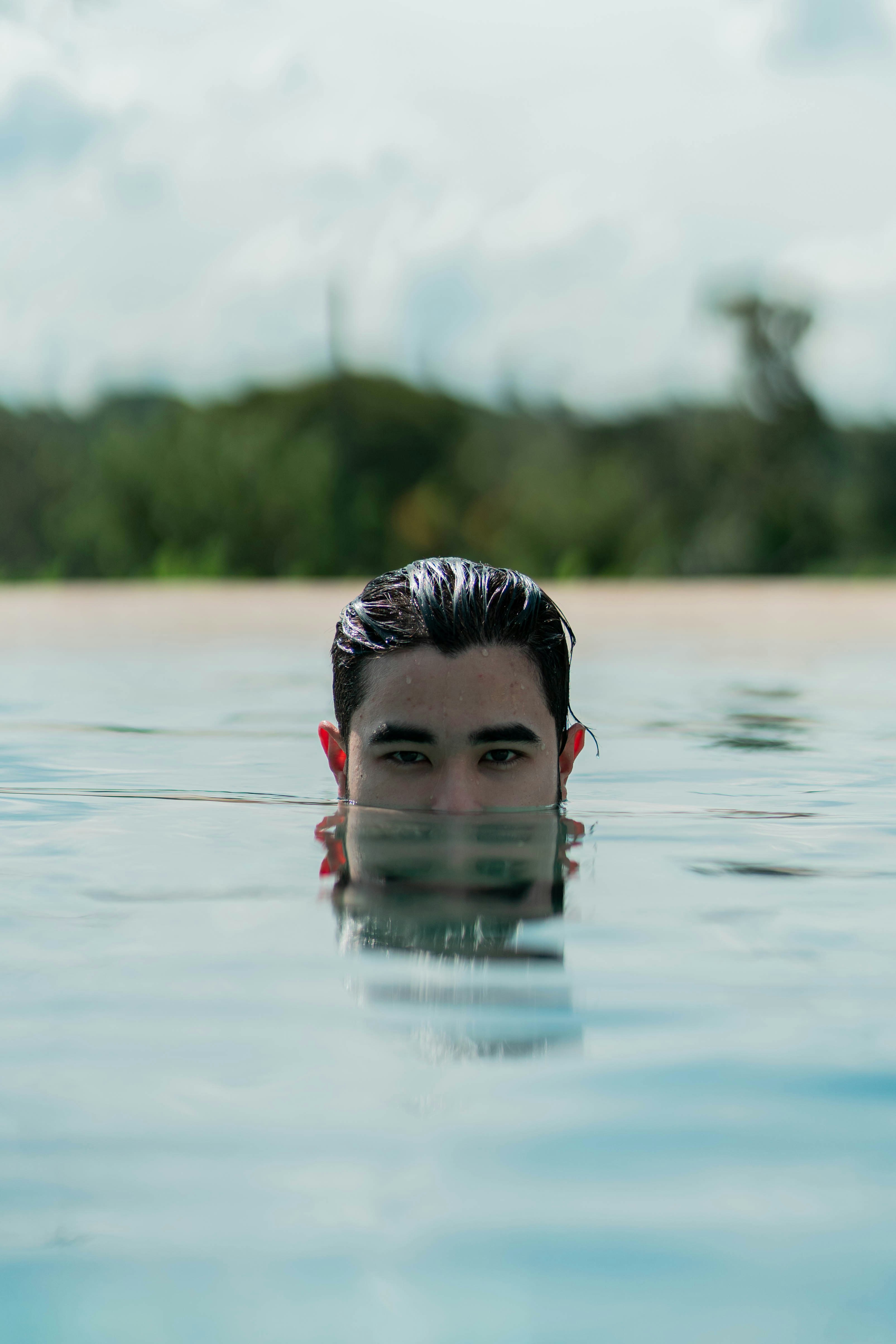 A person with a face mask in water photo – Free Grey Image on Unsplash