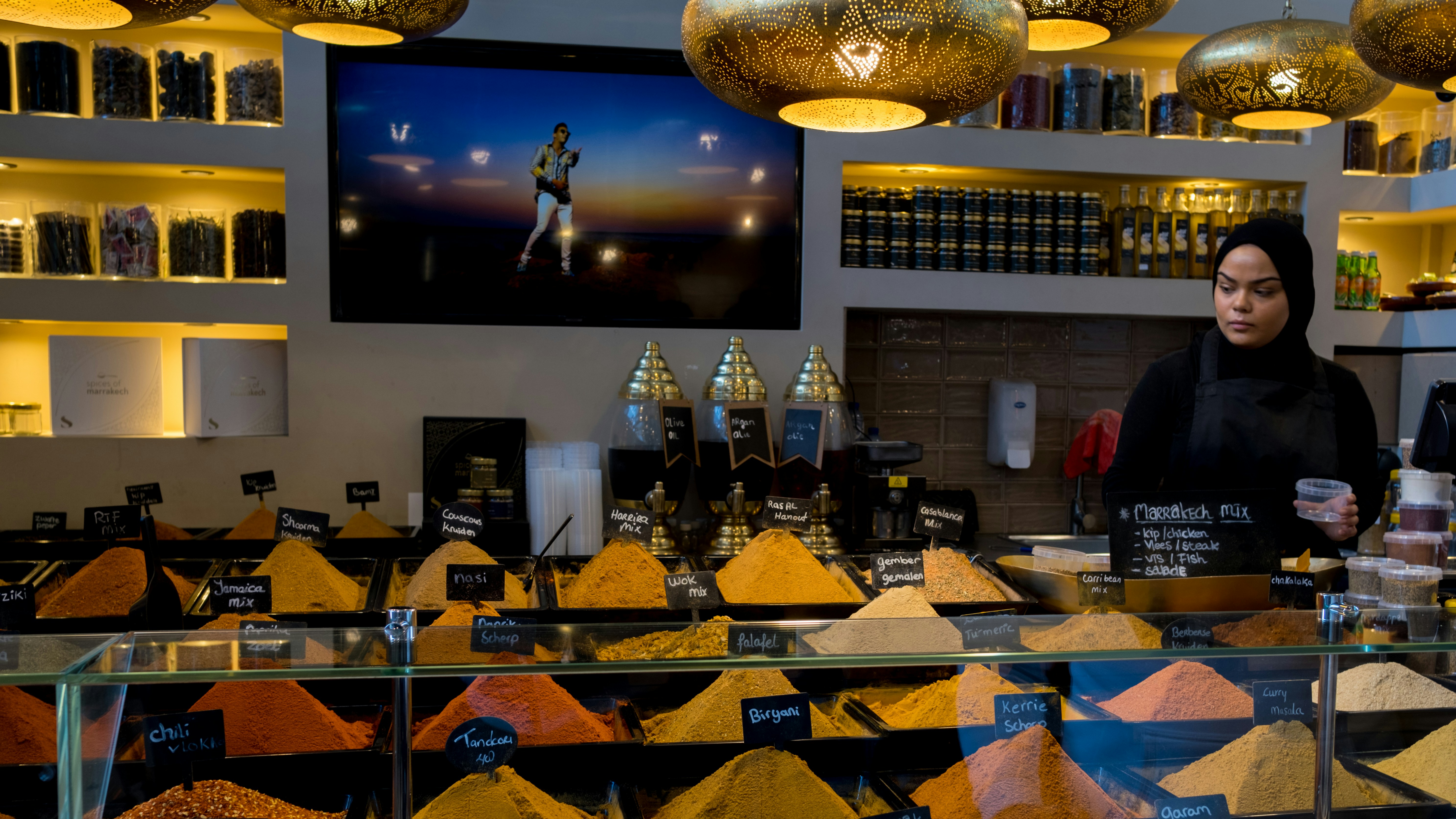 Amber Aisles: A Market Clerk Amid Pyramids of Spice