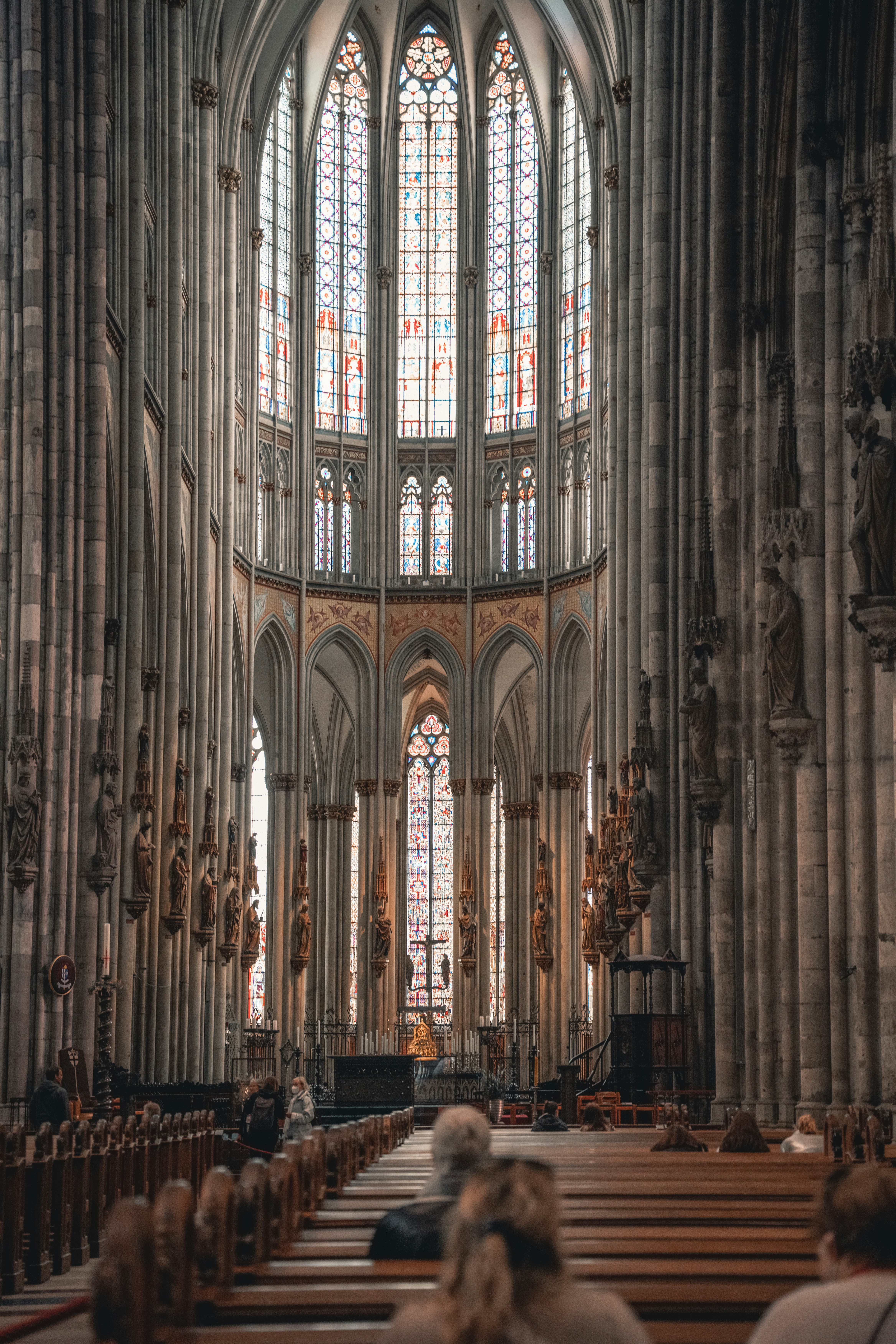 Aisle of Light: Altar Framed by Gothic Stained Glass