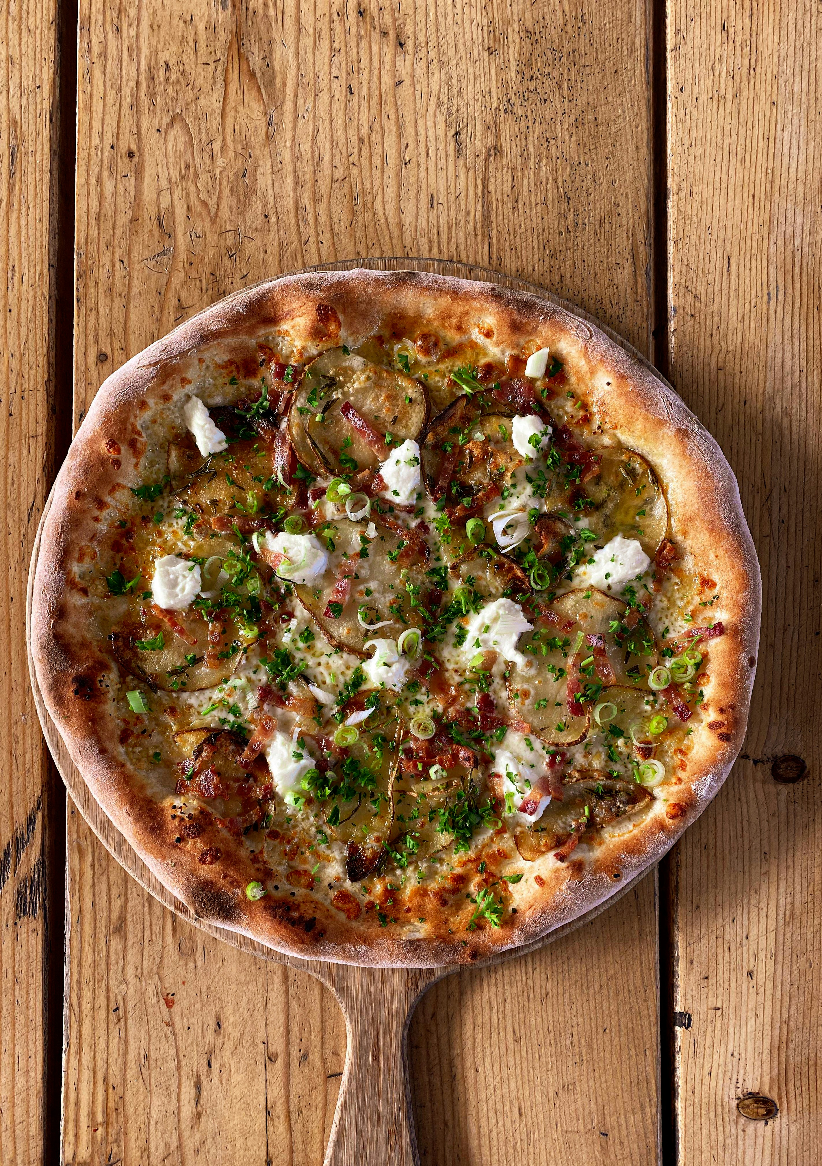 A pizza with cheese and toppings photo – Free Pizza Image on Unsplash