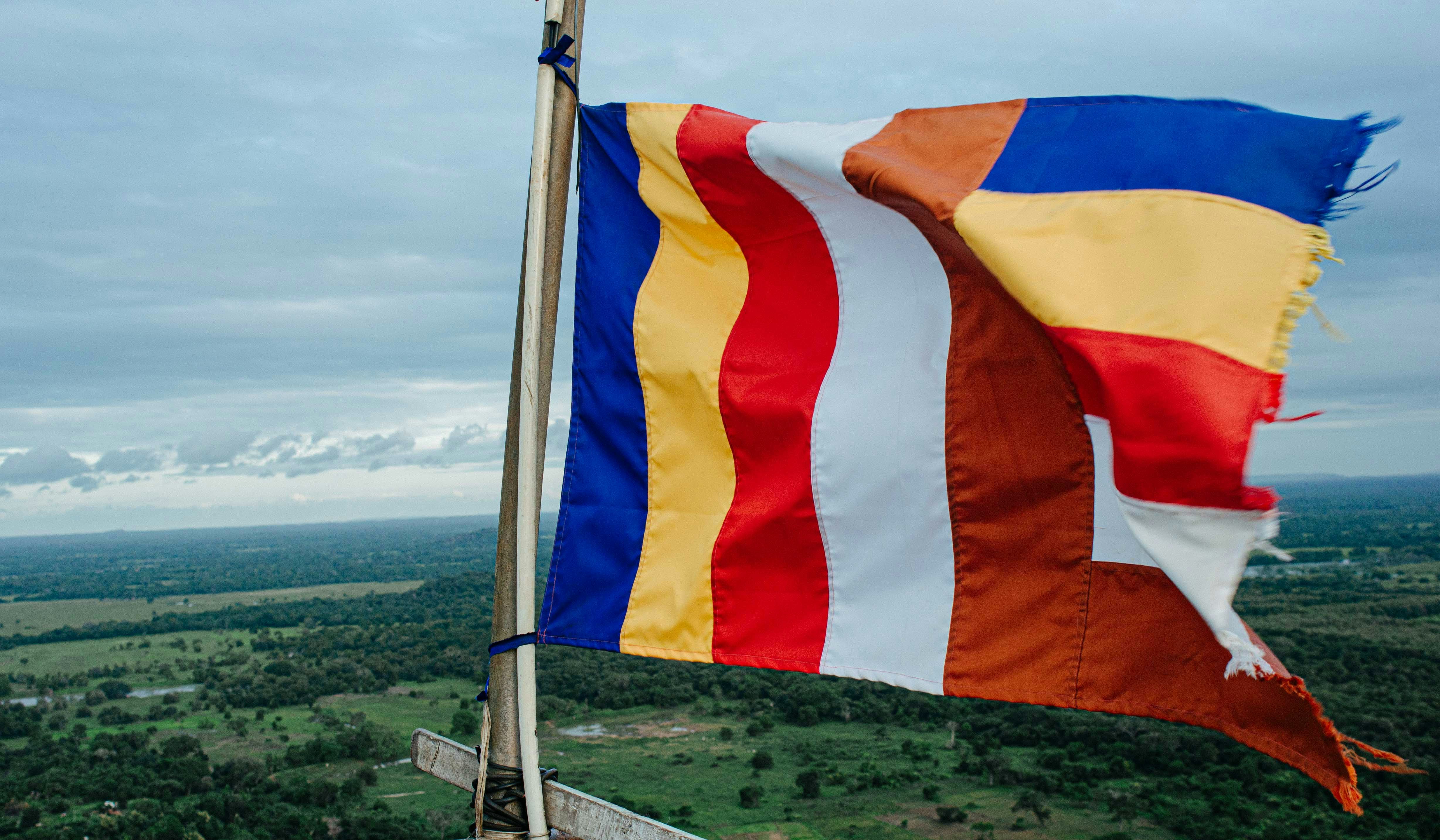 Windward Prism: A Multicolored Flag Framing the Prairie