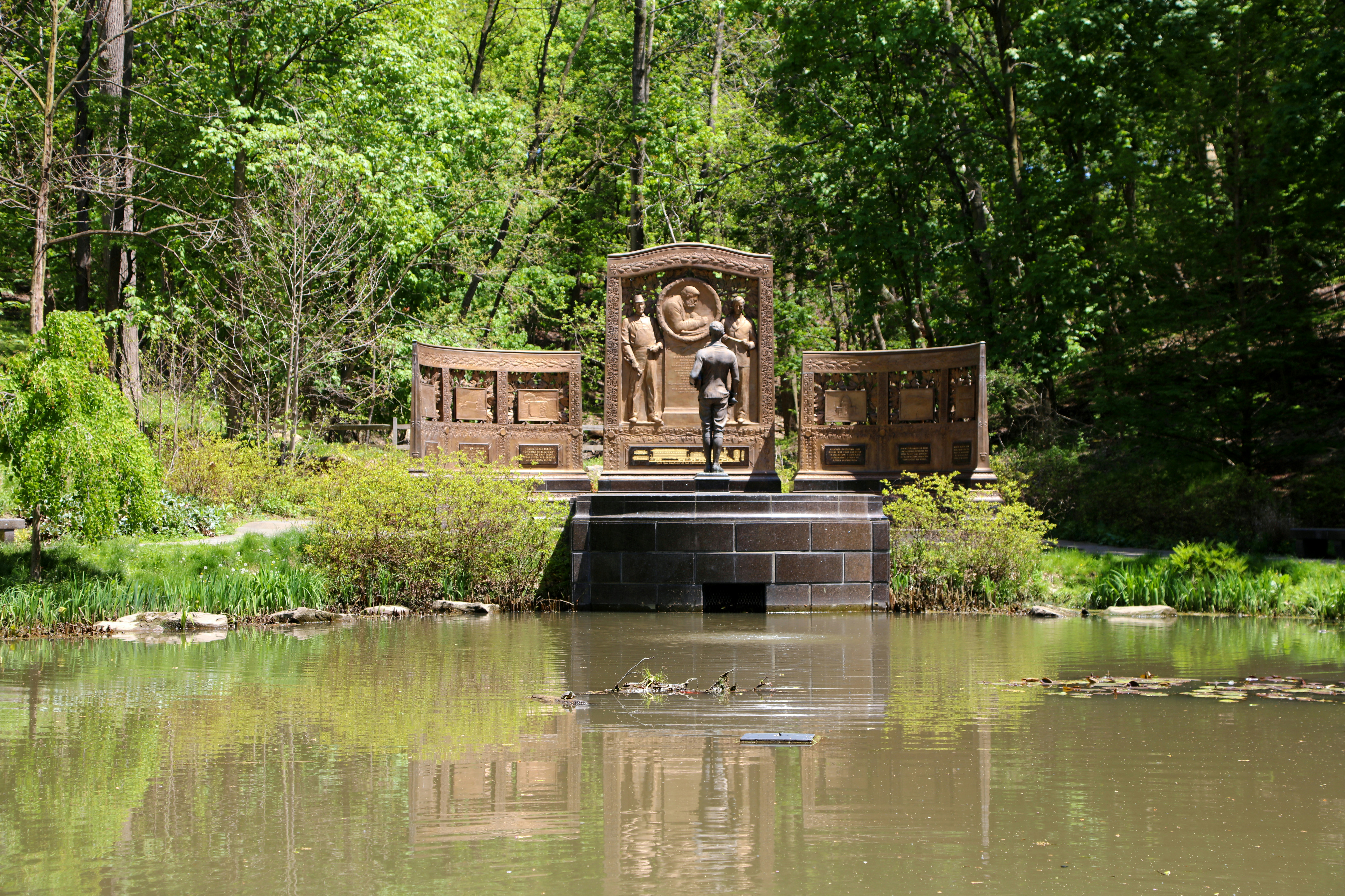A pond with a statue in the middle of it photo – Free Schenley park ...