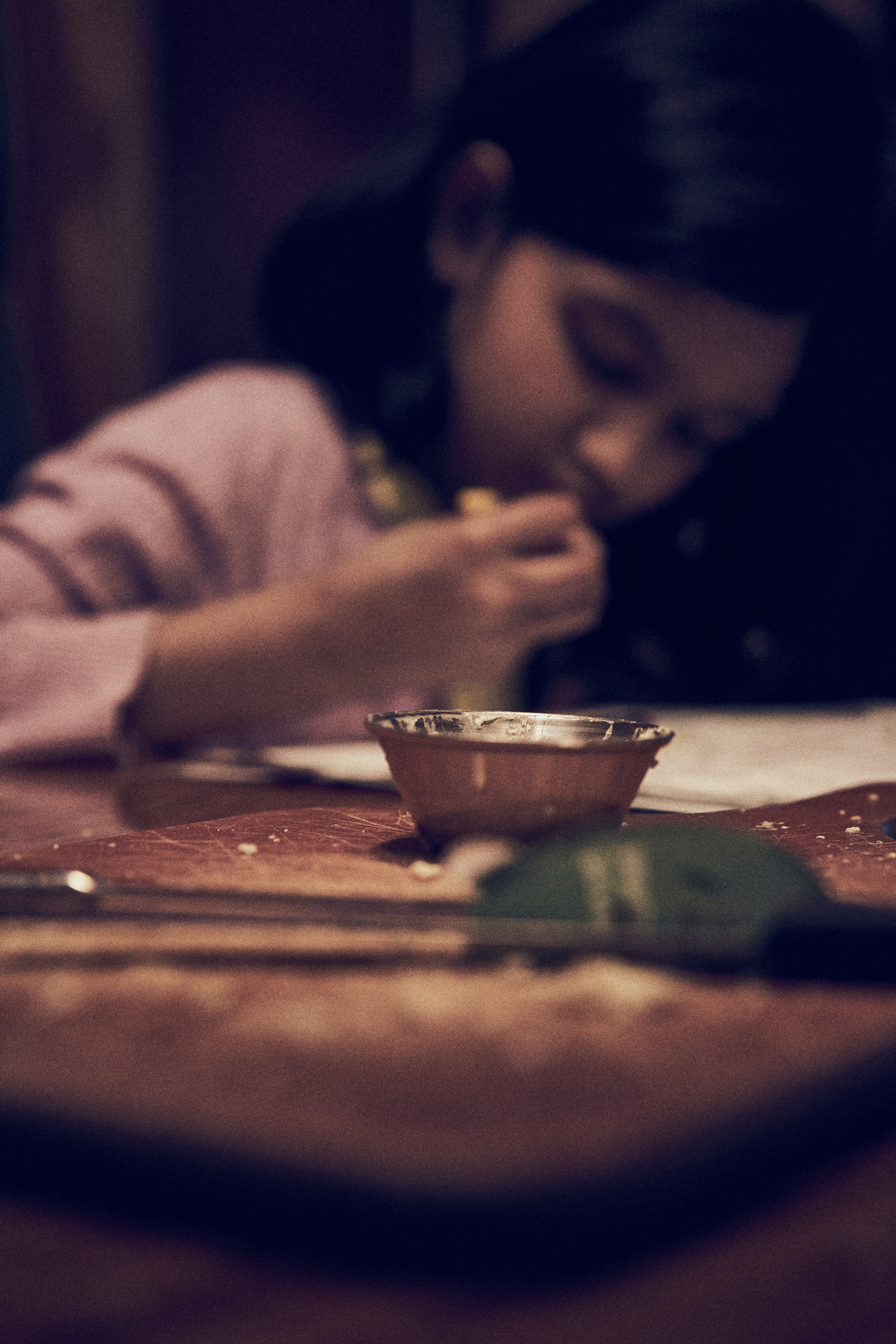 Blurred Focus: A Quiet Moment with a Snack and Nightlight Warmth