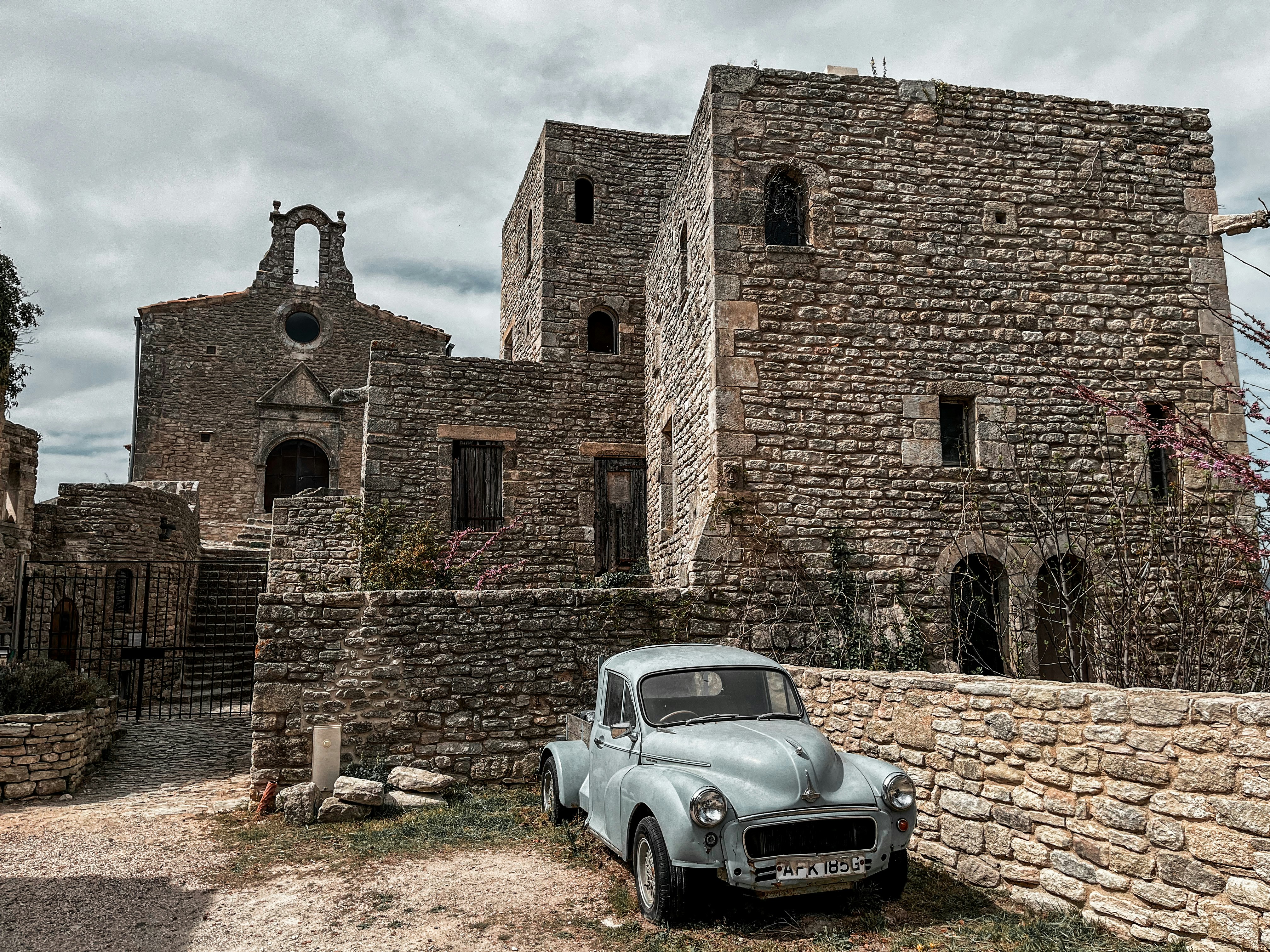 Vintage Car at a Weathered Castle Ruin